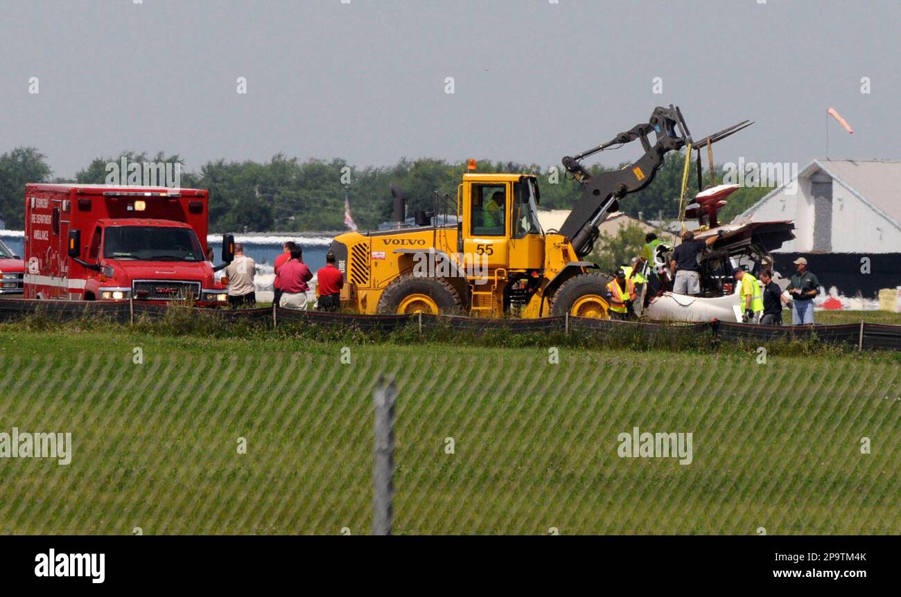 Rescue workers respond to a single engine plane that crashed on landing ...