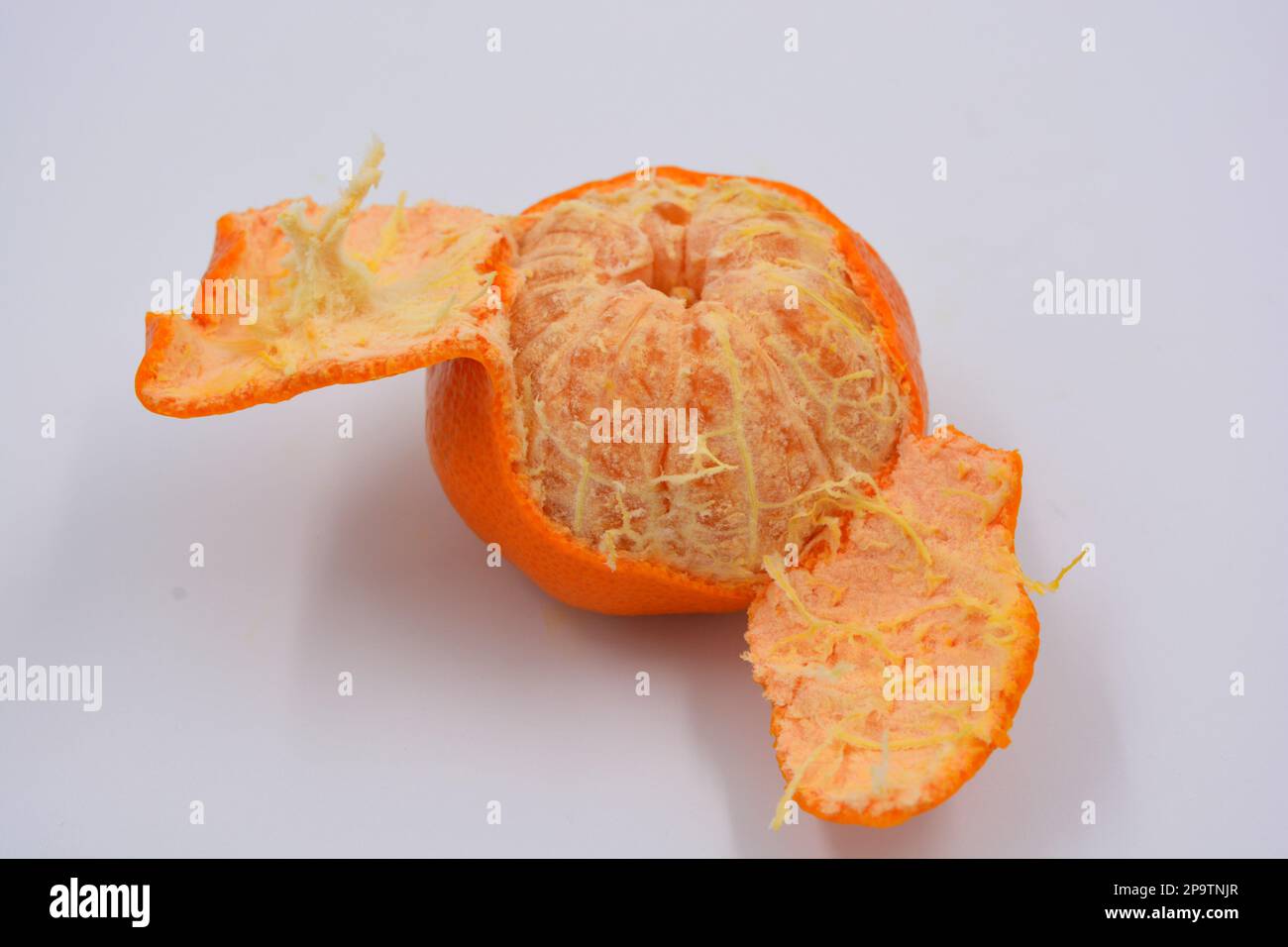 Fresh healthy fruits, orange tangerine with a thin skin removed is ...