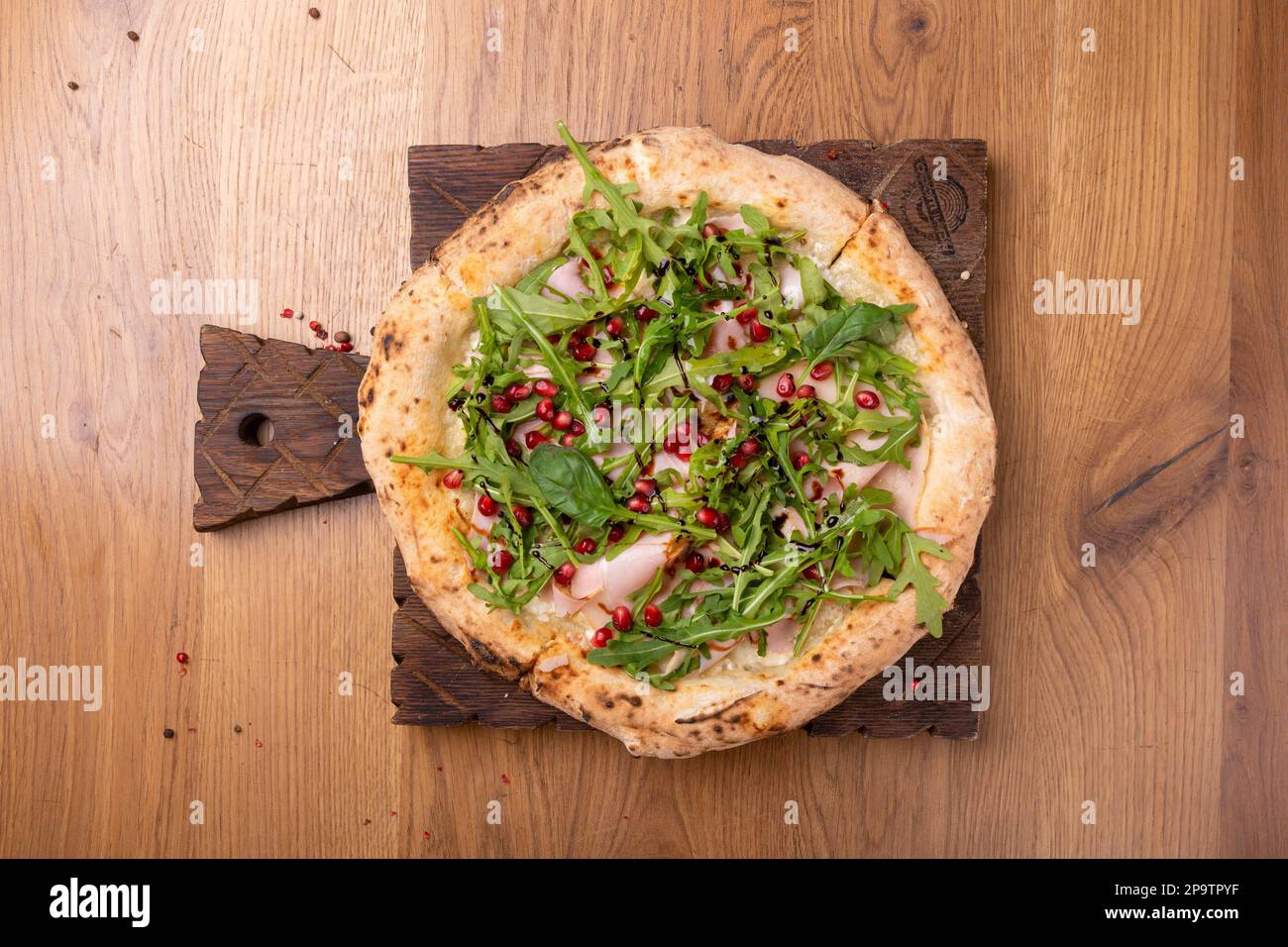 Oven-cooked Italian pizza Melagrano with Mozzarella cheese, ham, beef ...