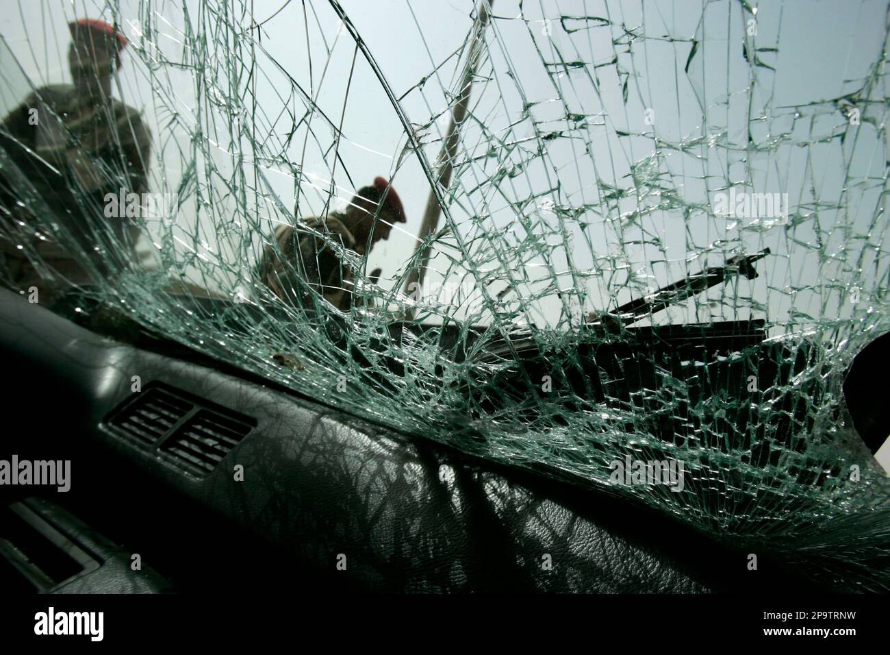 Iraqi army soldiers are seen through a broken windshield of a vehicle ...
