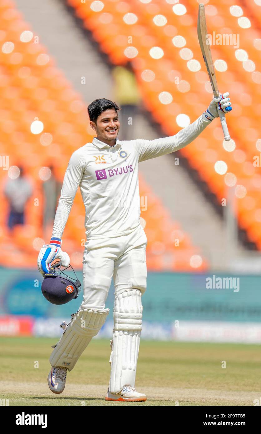 India's Shubman Gill raises his bat to celebrate scoring a century ...