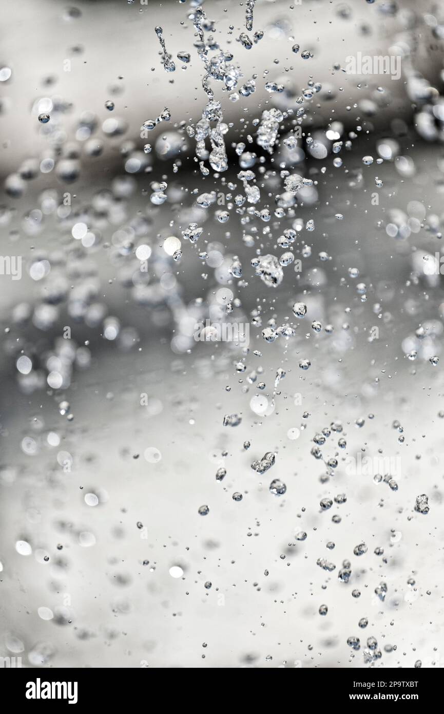 water droplets of different shapes and sizes suspended in the air Stock ...