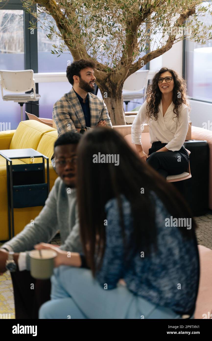 Two business couples. One is having a fun conversation and the other ...