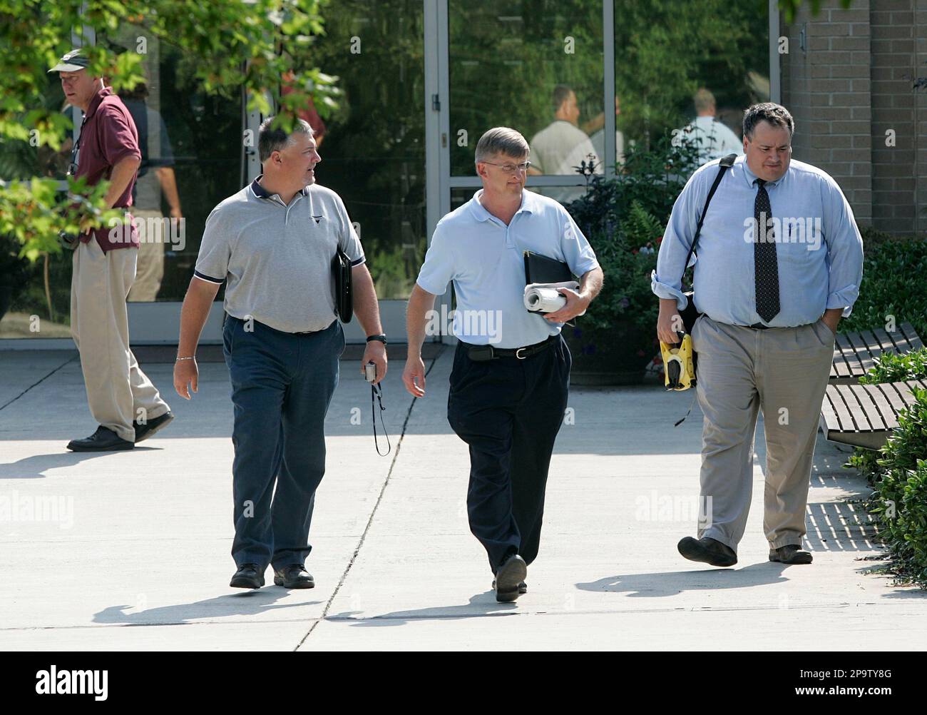 Investigators leave the Tennessee Valley Unitarian Universalist Church ...