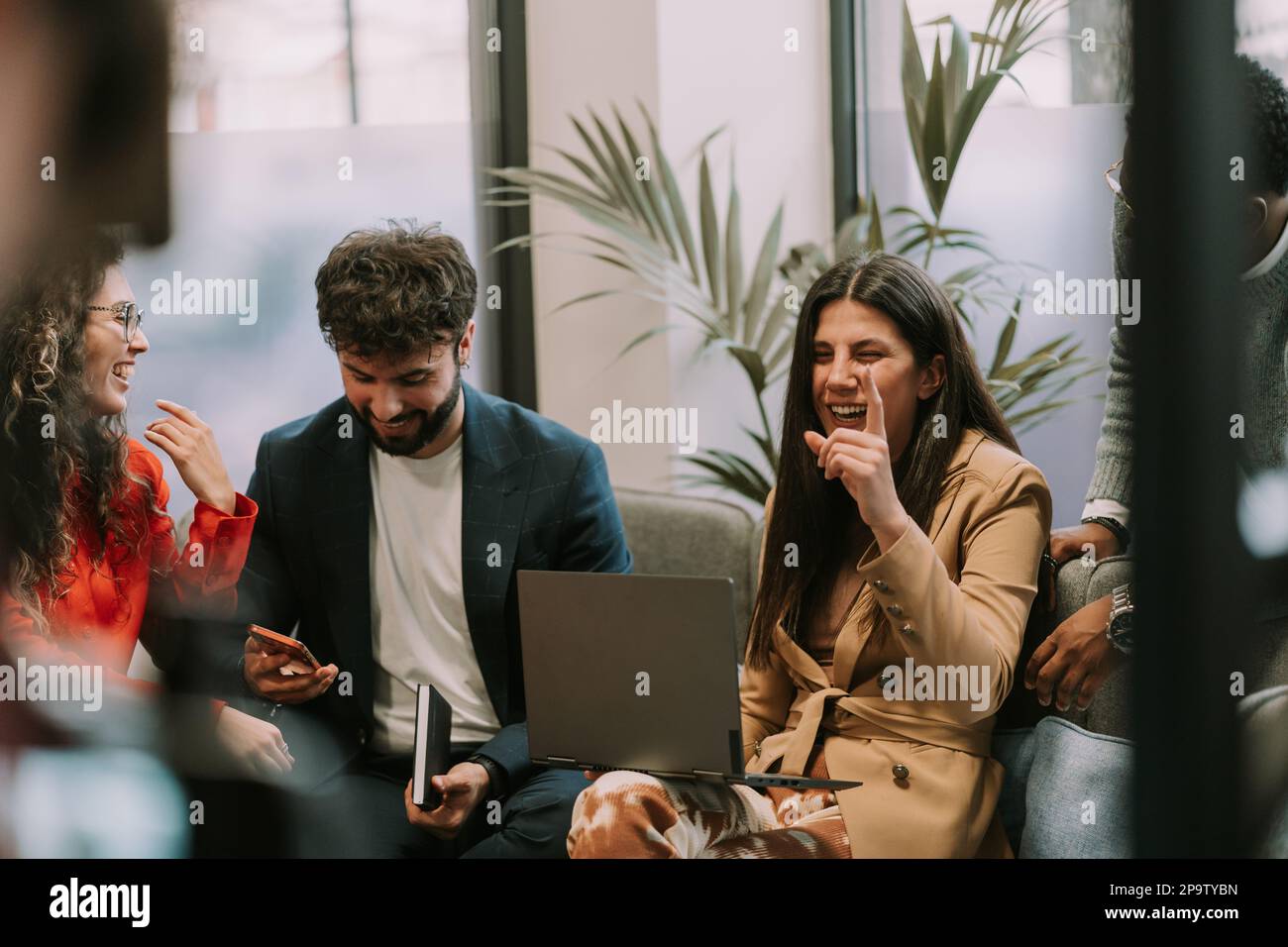 Two female and one male people laughing joking with their handsome ...