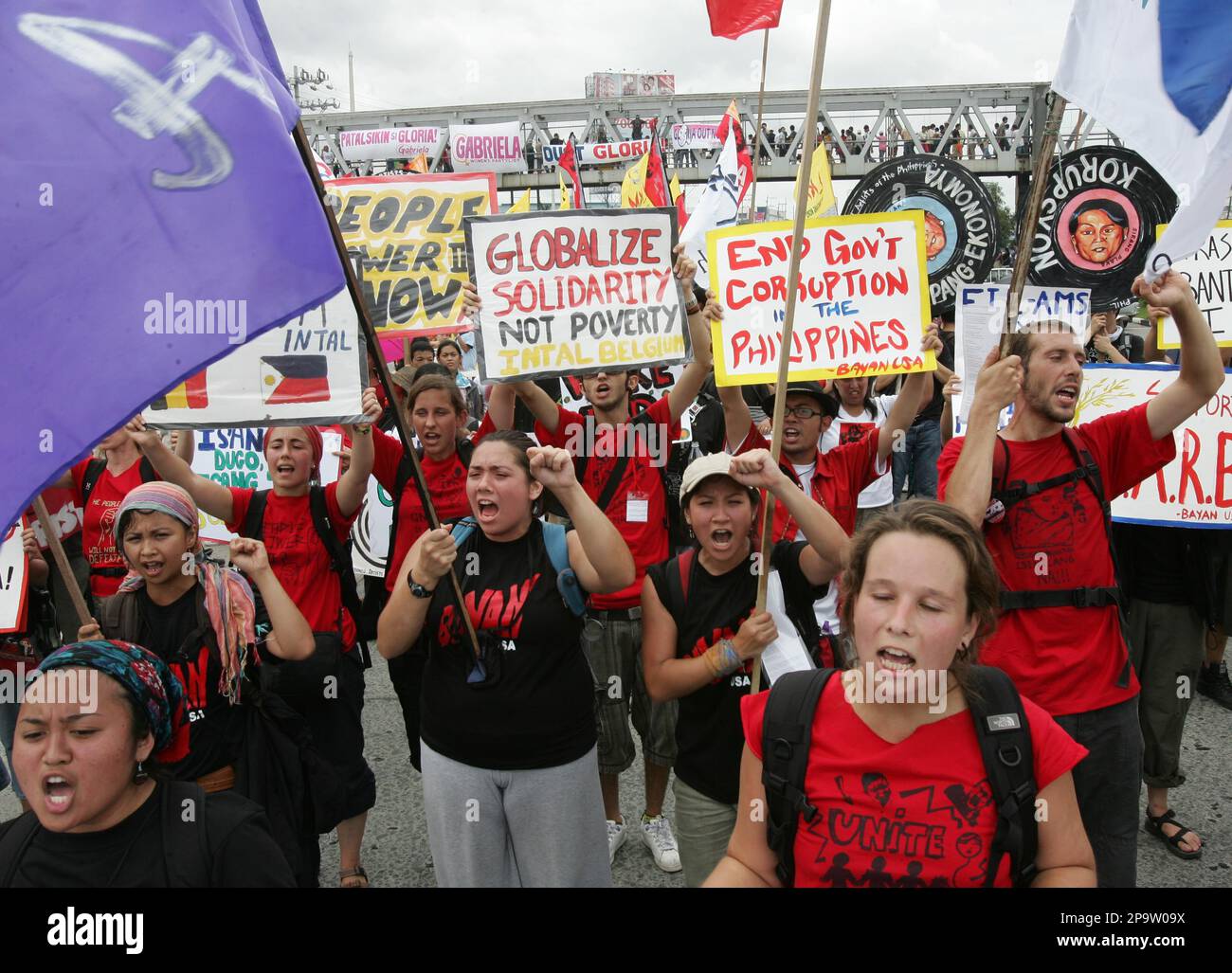 Filipino-Americans shout slogans as they join thousands of protesters ...