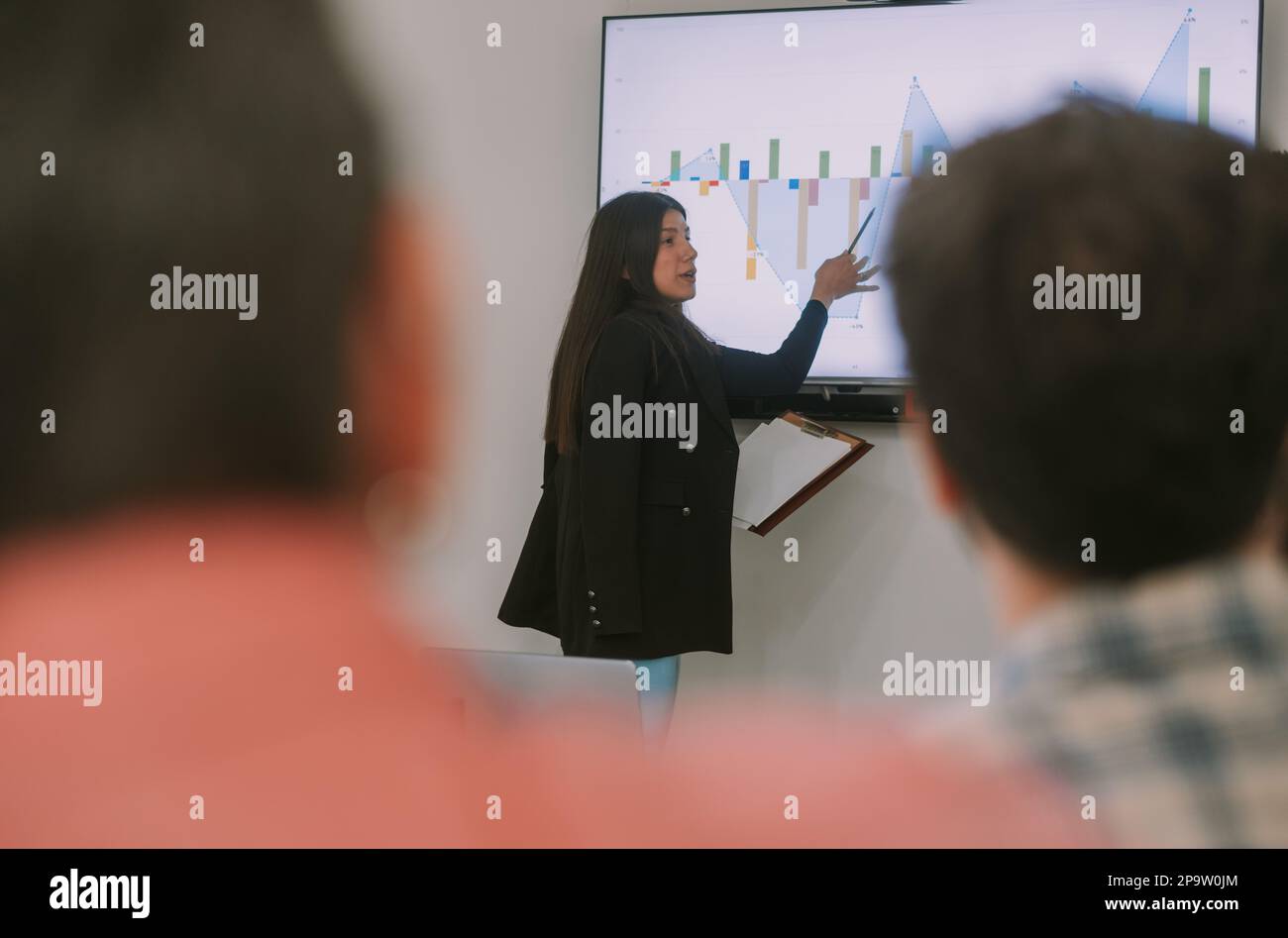 Close up of beautiful business woman presenting something to his ...