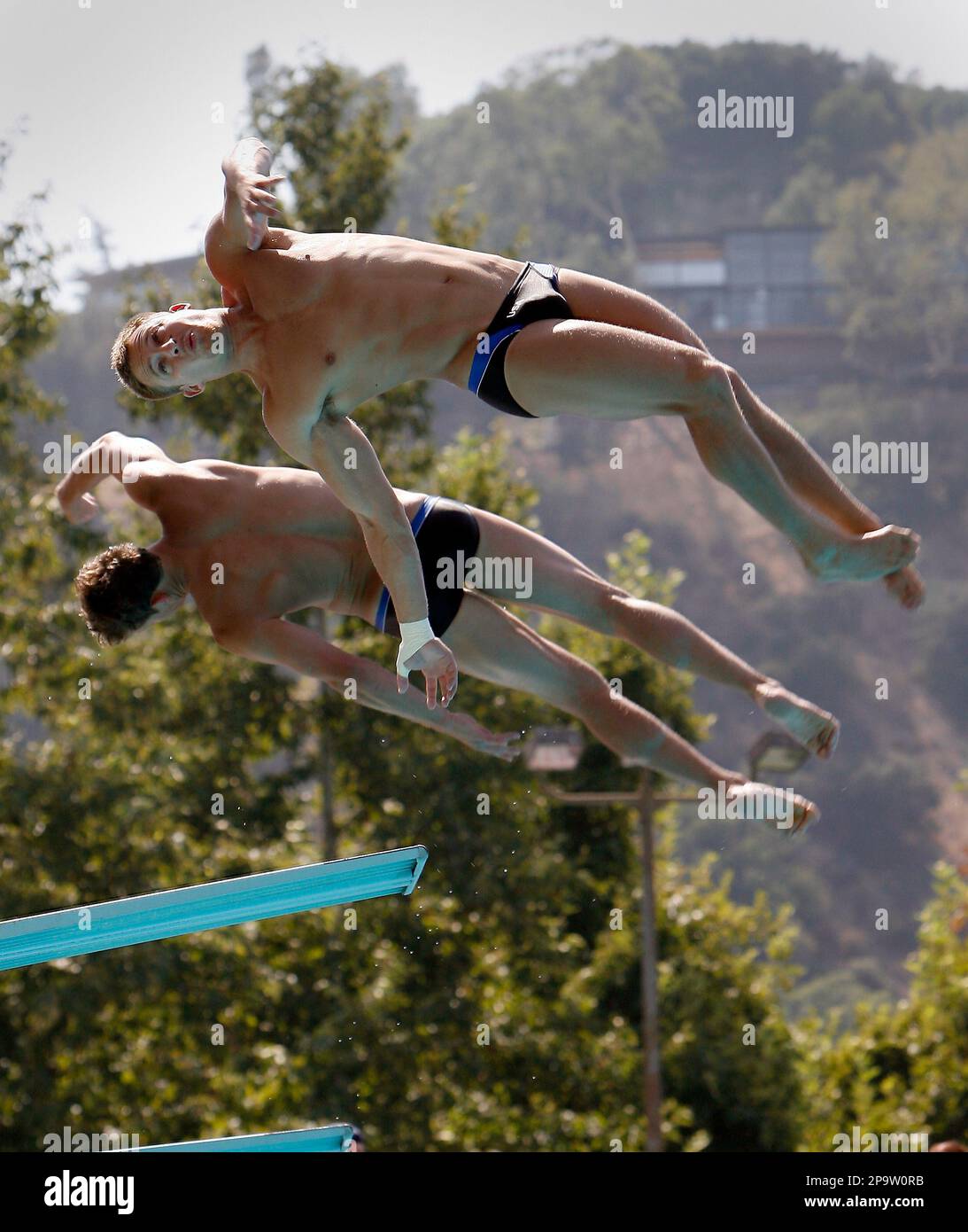 Christopher Colwill, front and Jevon Tarantino, back, dive in the ...