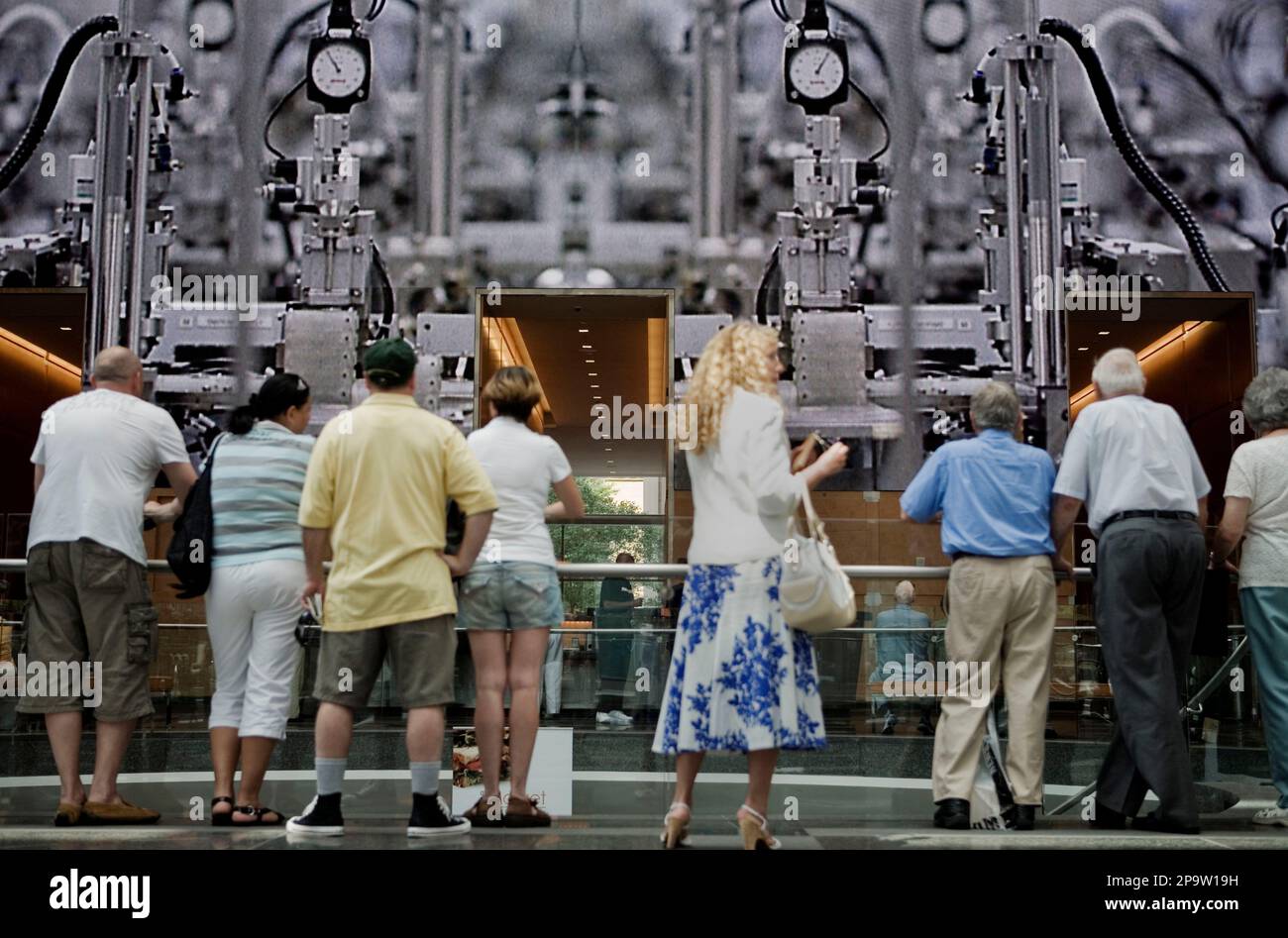 Visitors view the high-definition LED screen in the main lobby of the ...