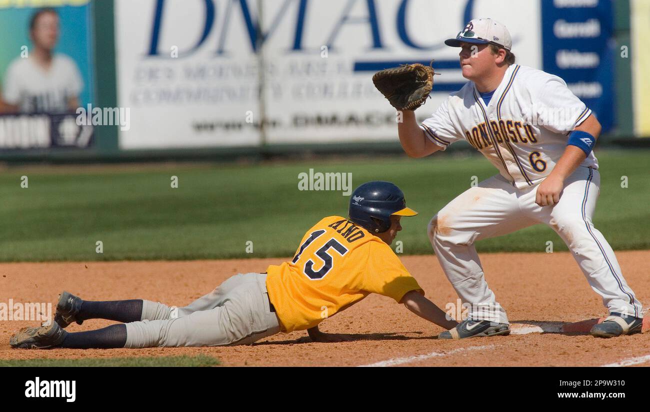 North Sentral Kossuth's Skyler Mino, left, slides safely back to first ...