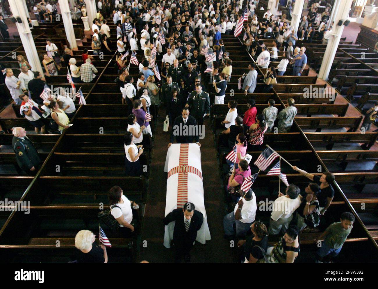 The casket of Staff Sgt. Alex Jimenez is led from St. Mary's of the ...