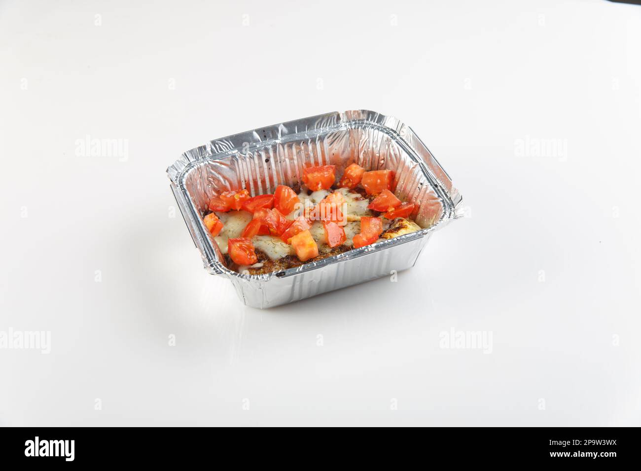 Pasta, conchiglie pasta, with a tomato and basil sauce topped with ...