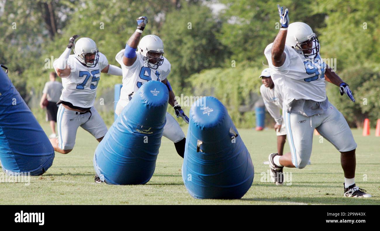 Detroit Lions' Shaun Cody, Chuck Darby and Landon Cohen, from left, go ...