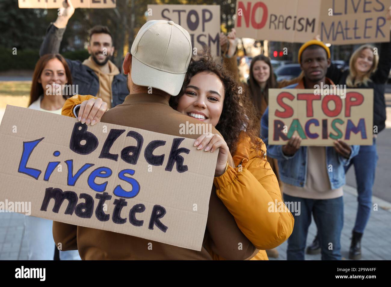 People hugging at protest hi-res stock photography and images - Alamy