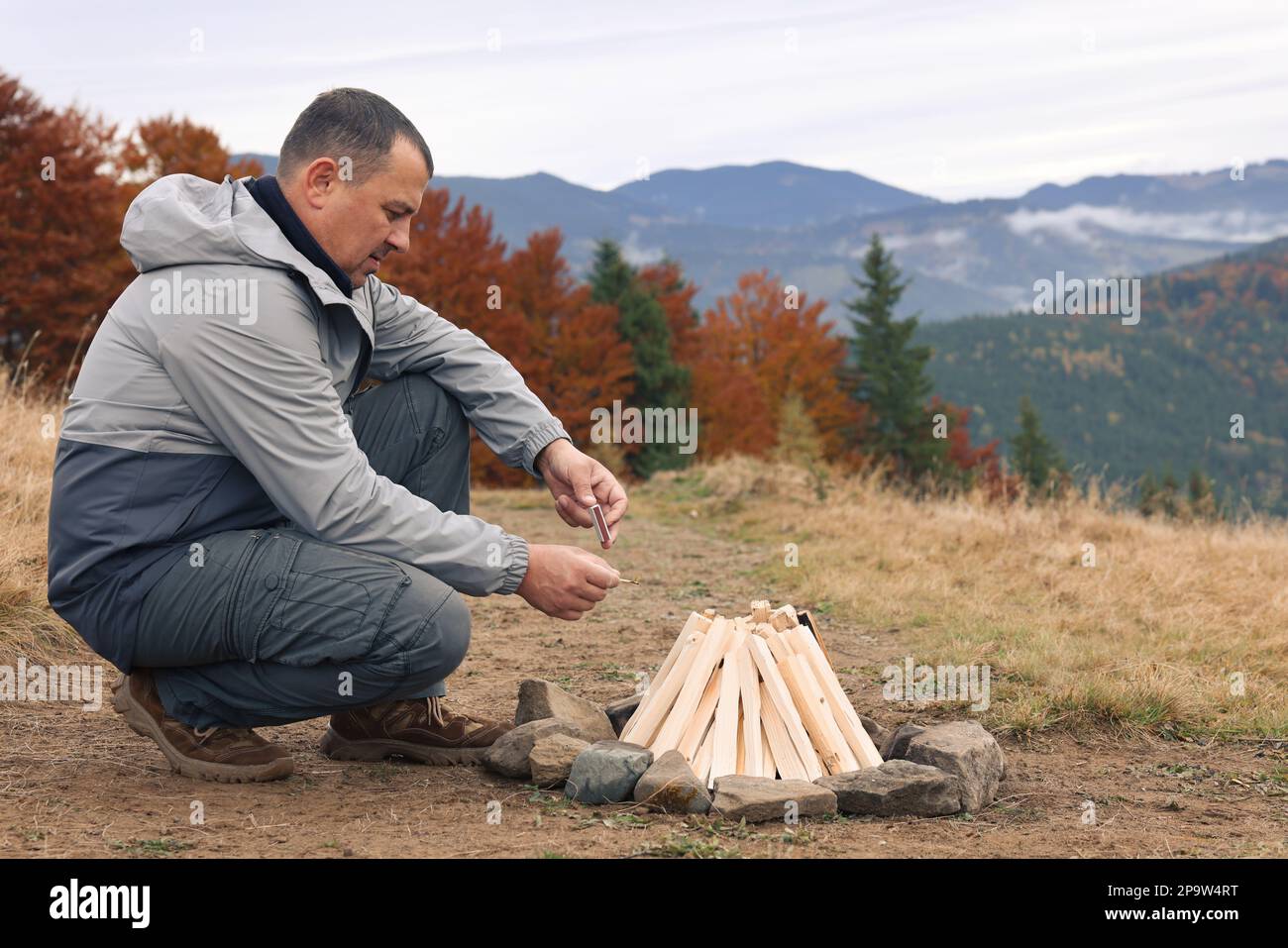 Man making fire stones hi-res stock photography and images - Alamy