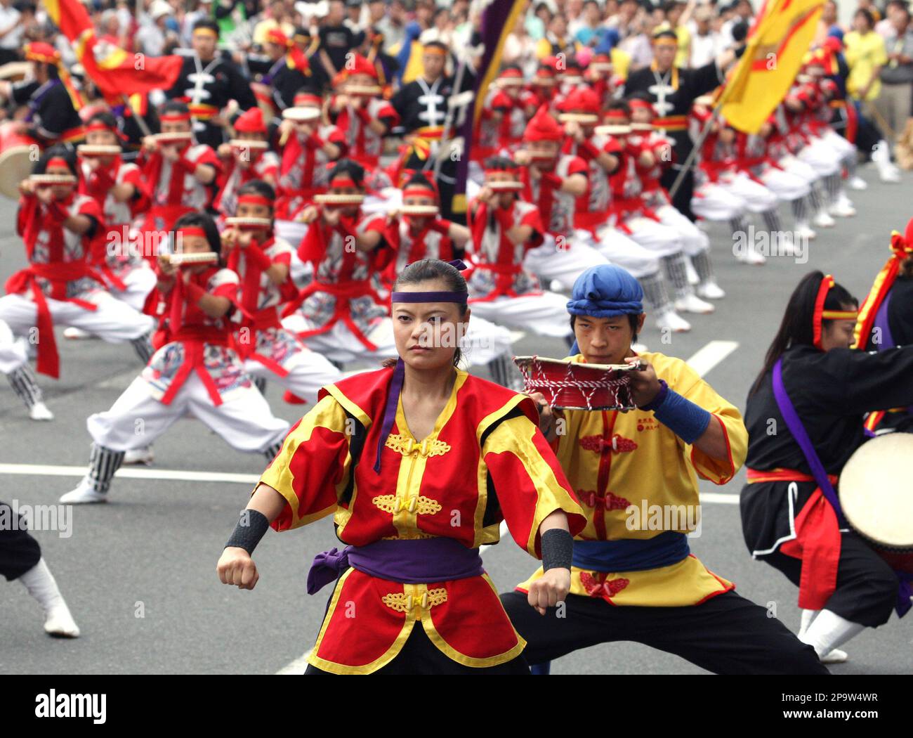 Performers, wearing traditional costume of southern Japanese Island of ...