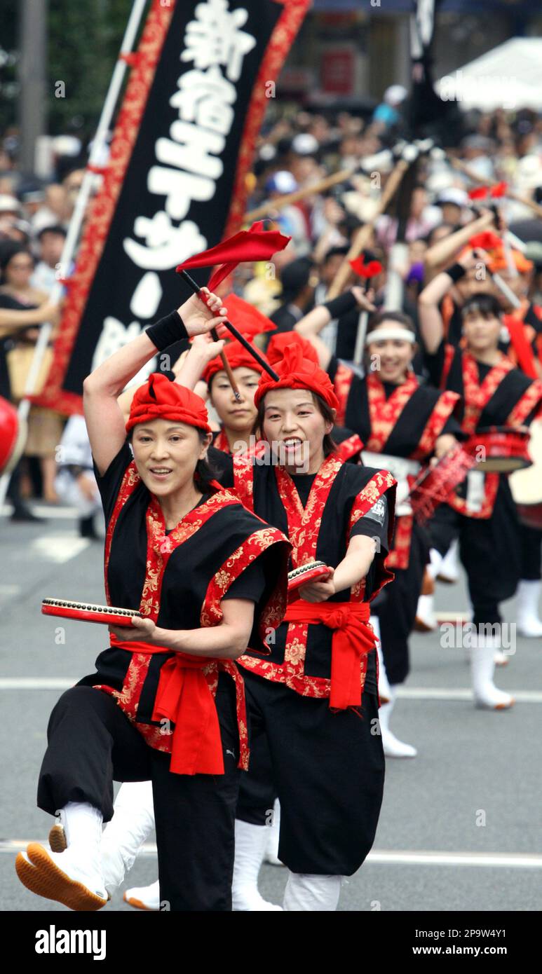 Performers, wearing traditional costume of southern Japanese island of ...