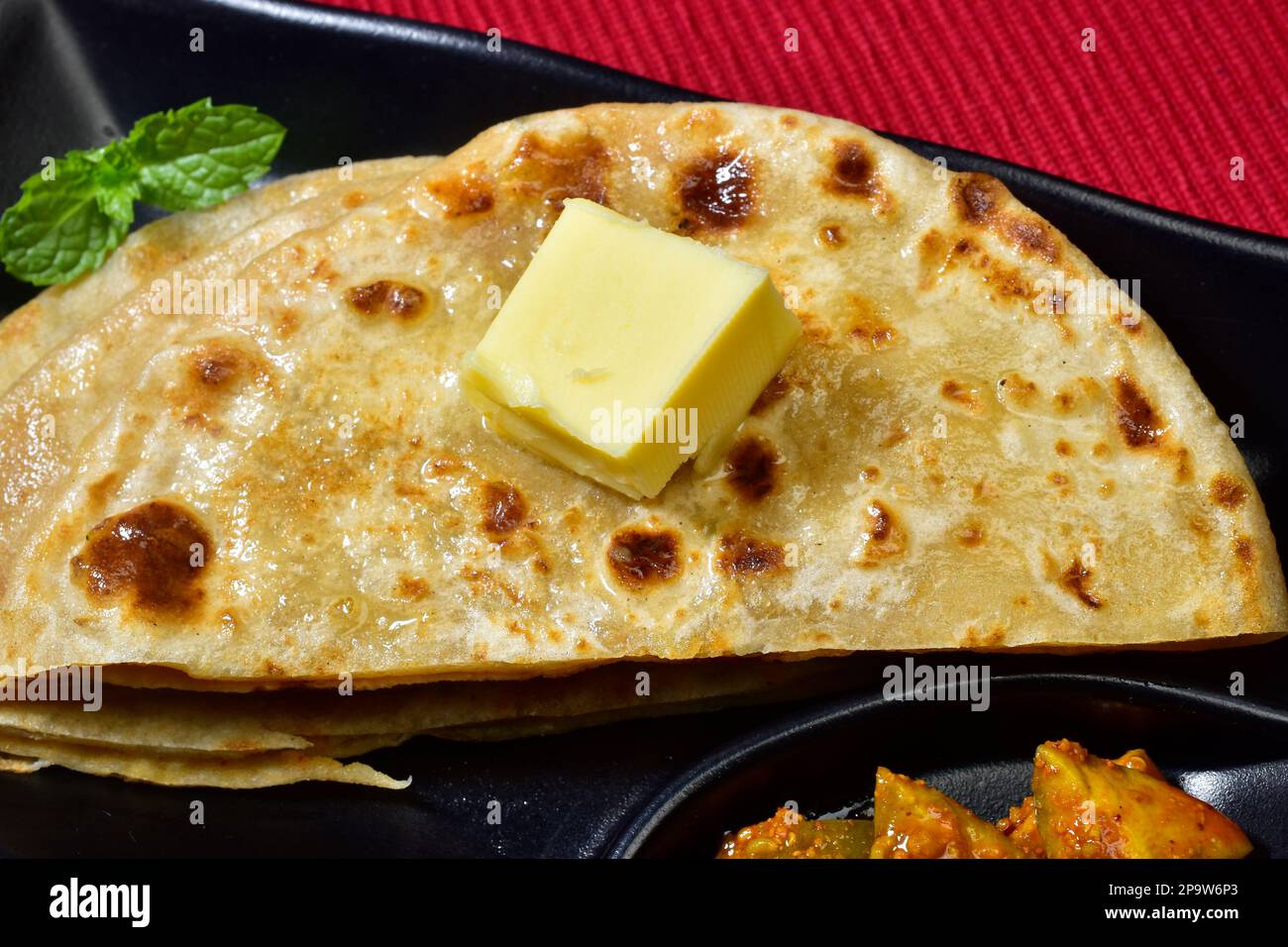 Closeup of stuffed paratha with butter, indian food Stock Photo - Alamy