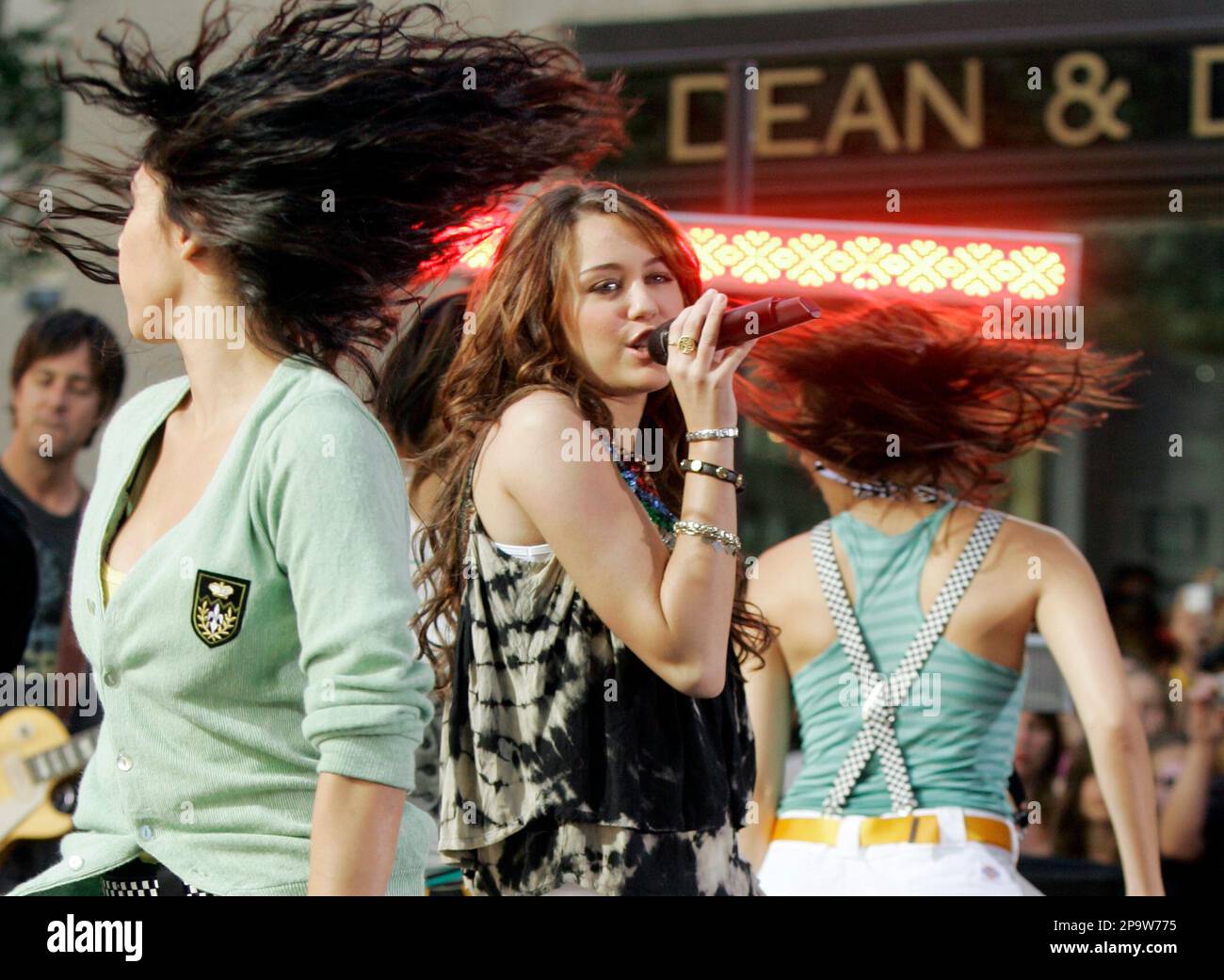 Actress and singer Miley Cyrus, center, performs on the NBC "Today ...