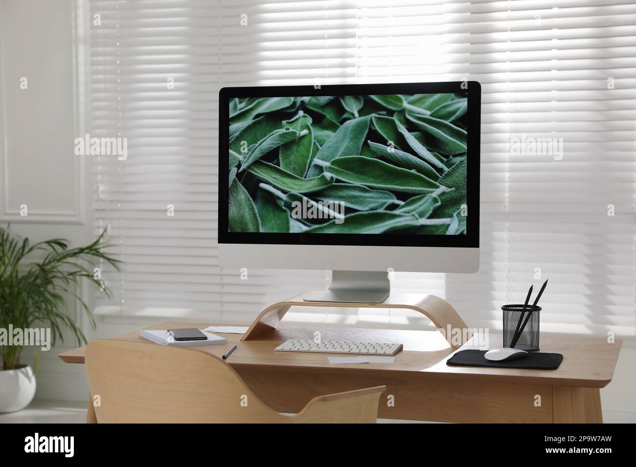 Comfortable workplace with modern computer near window in room Stock ...