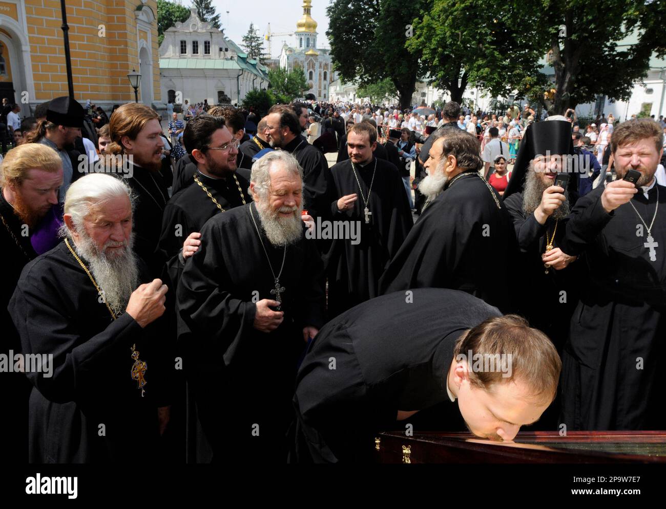 Ukrainian Orthodox priests kiss an icon during celebrations marking the ...