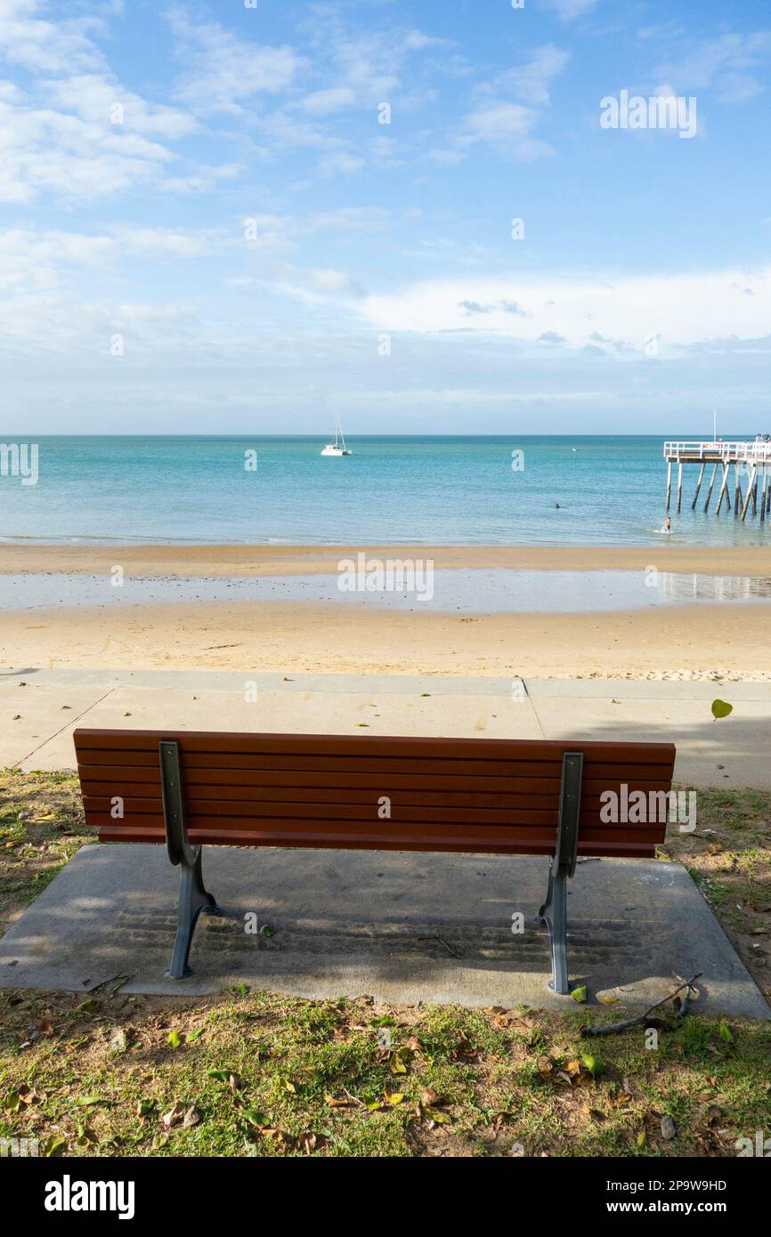 Empty bench in the shade on Torquay beach, Hervey Bay, Queensland ...