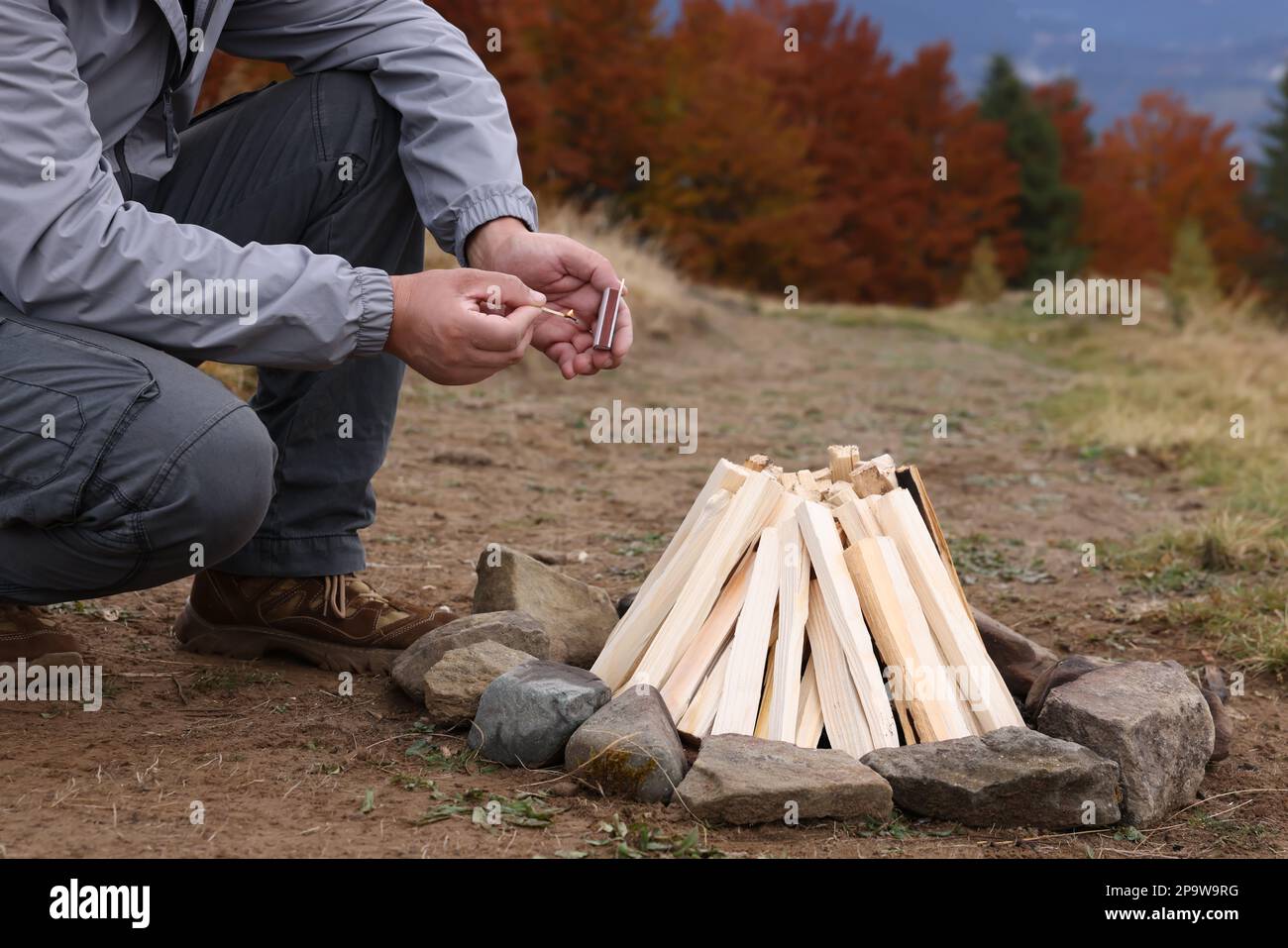 Man making fire stones hi-res stock photography and images - Alamy