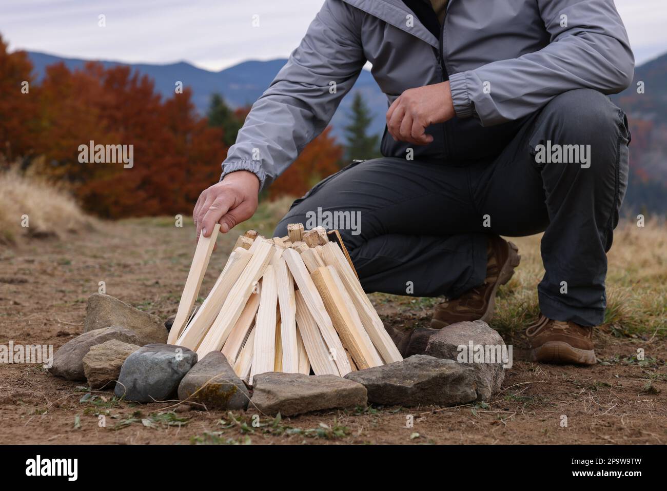 Man making fire stones hi-res stock photography and images - Alamy