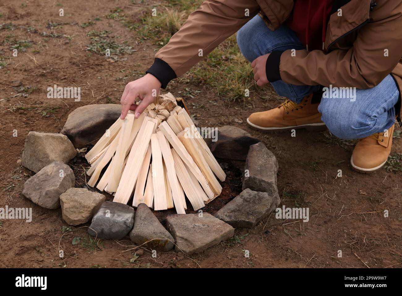 Man making fire stones hi-res stock photography and images - Alamy