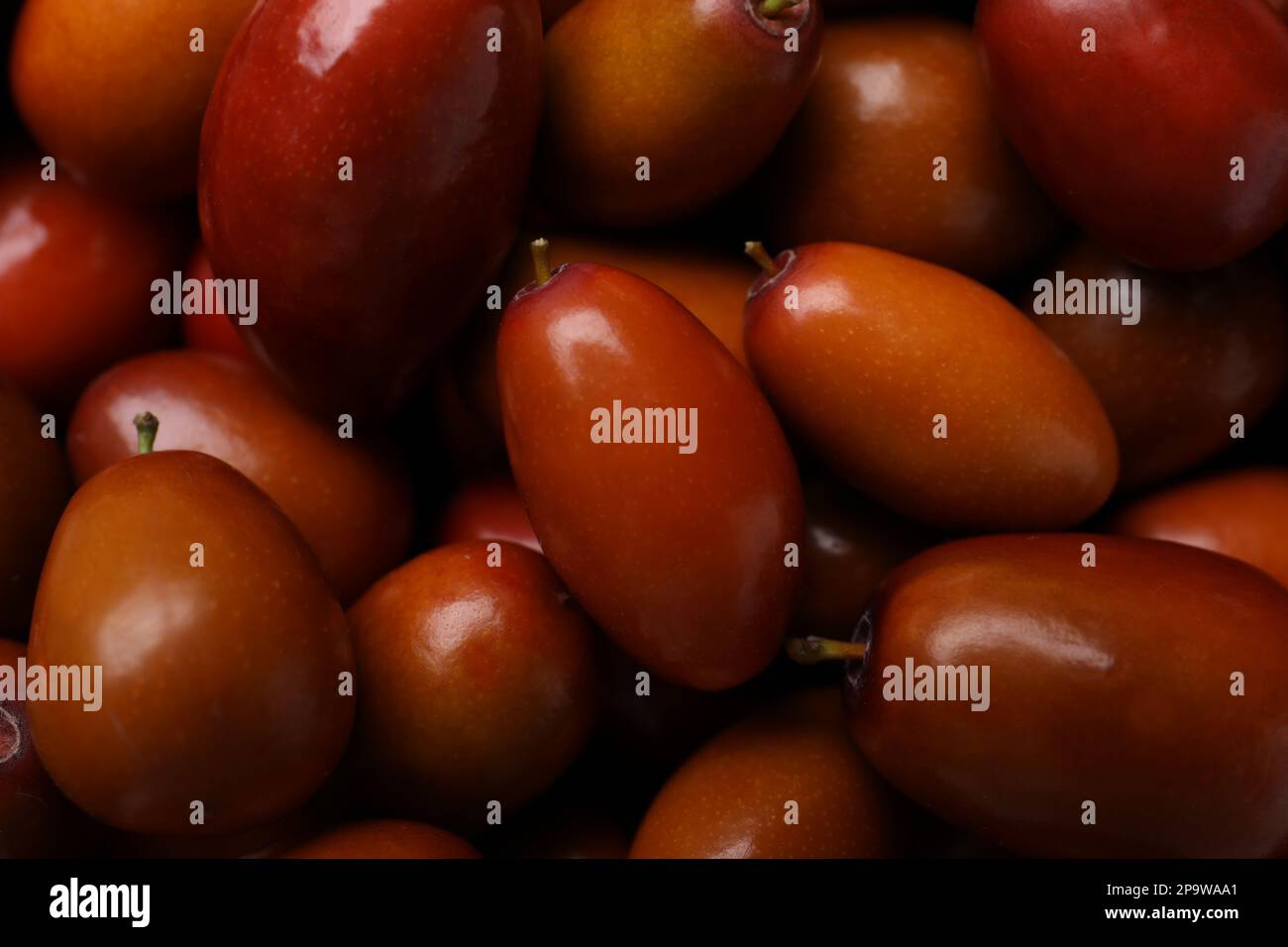 Closeup view of fresh Ziziphus jujuba fruits as background Stock Photo ...