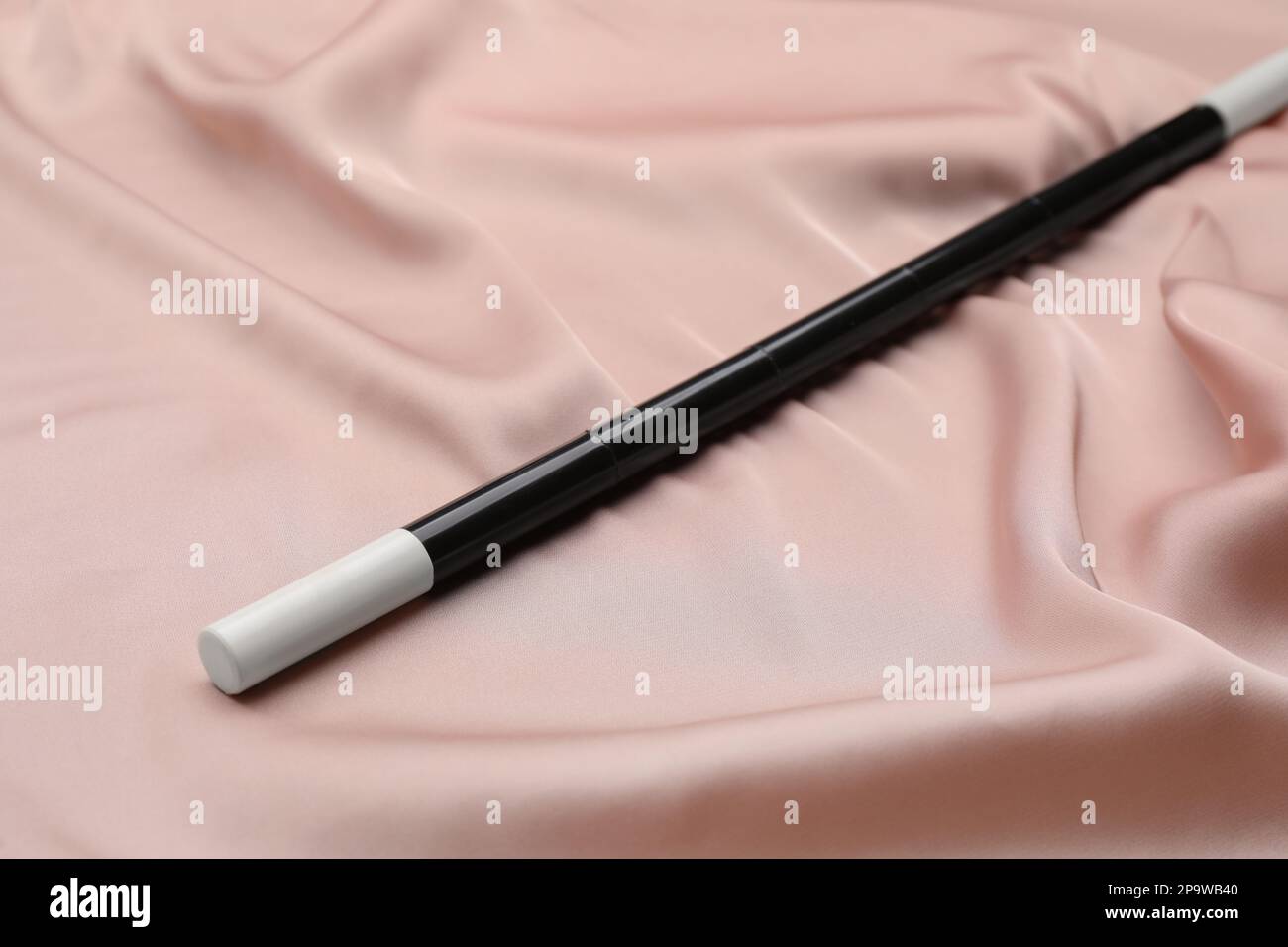 Beautiful black magic wand on pink fabric Stock Photo - Alamy