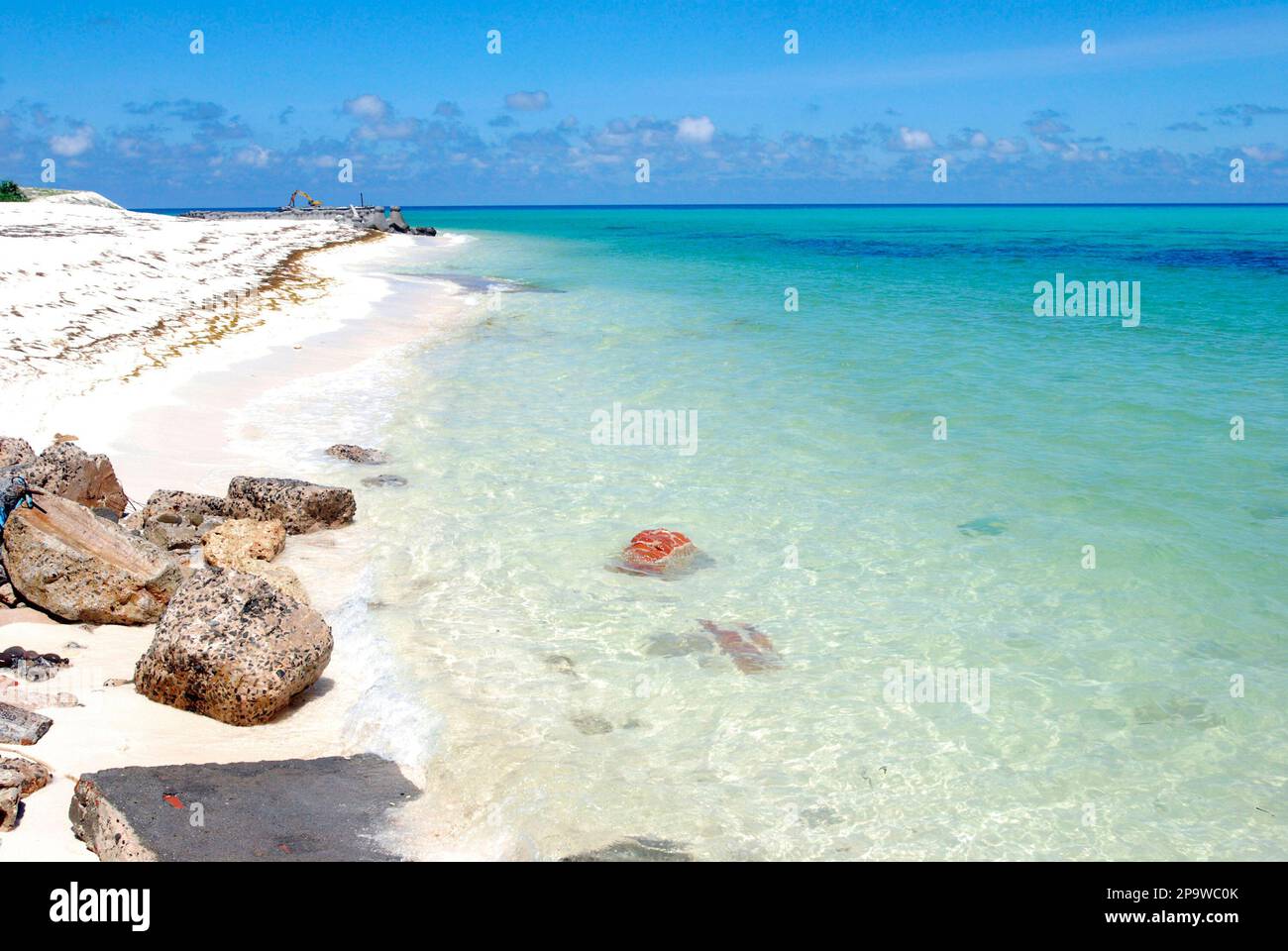 White coralline sand overspread on the beach on Dongsha Island, on ...
