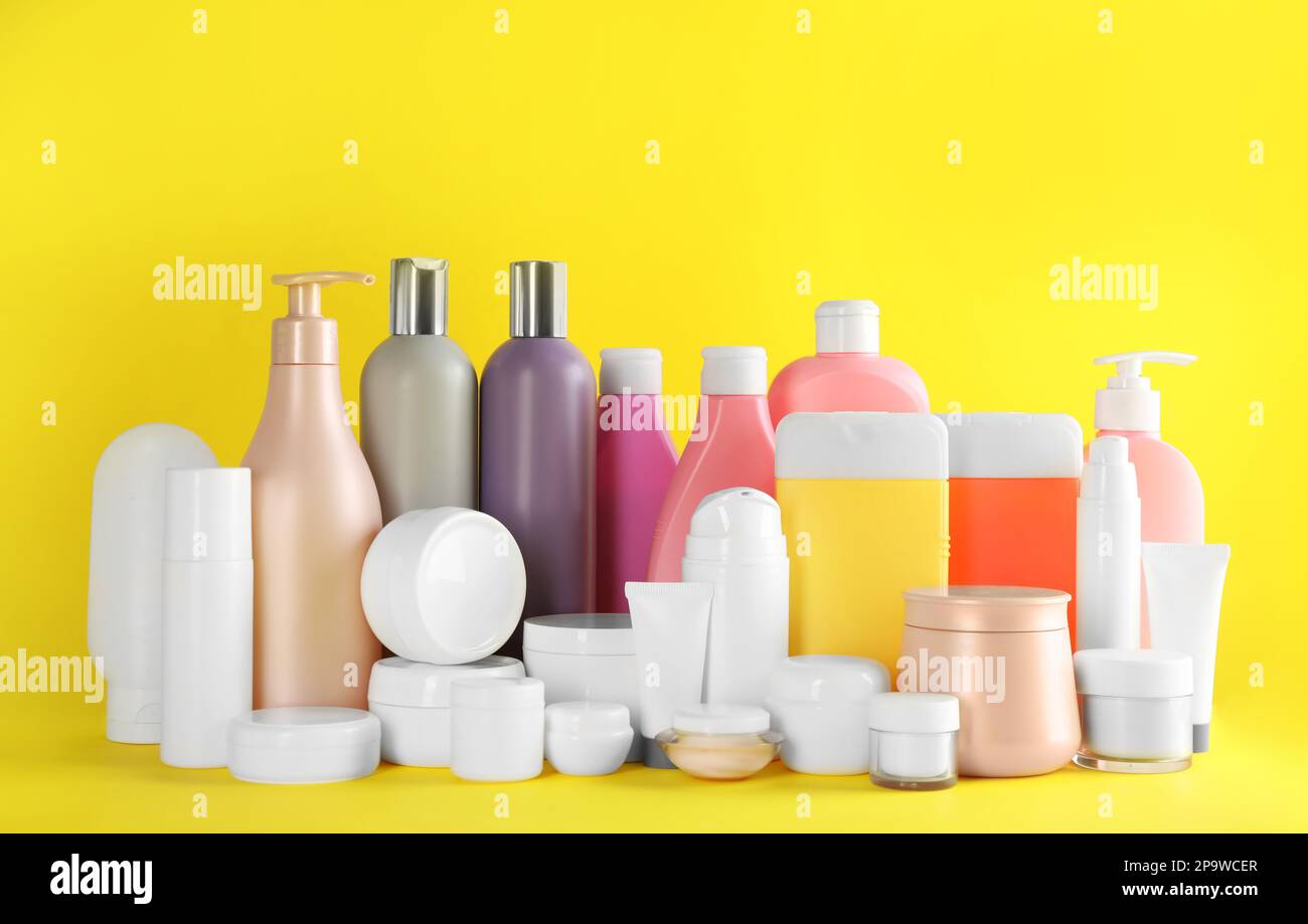 Many different cosmetic products on yellow background Stock Photo - Alamy
