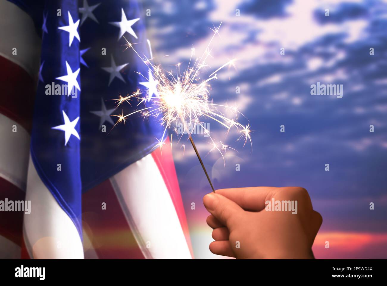 4th of July - Independence Day of USA. Woman holding burning sparkler ...