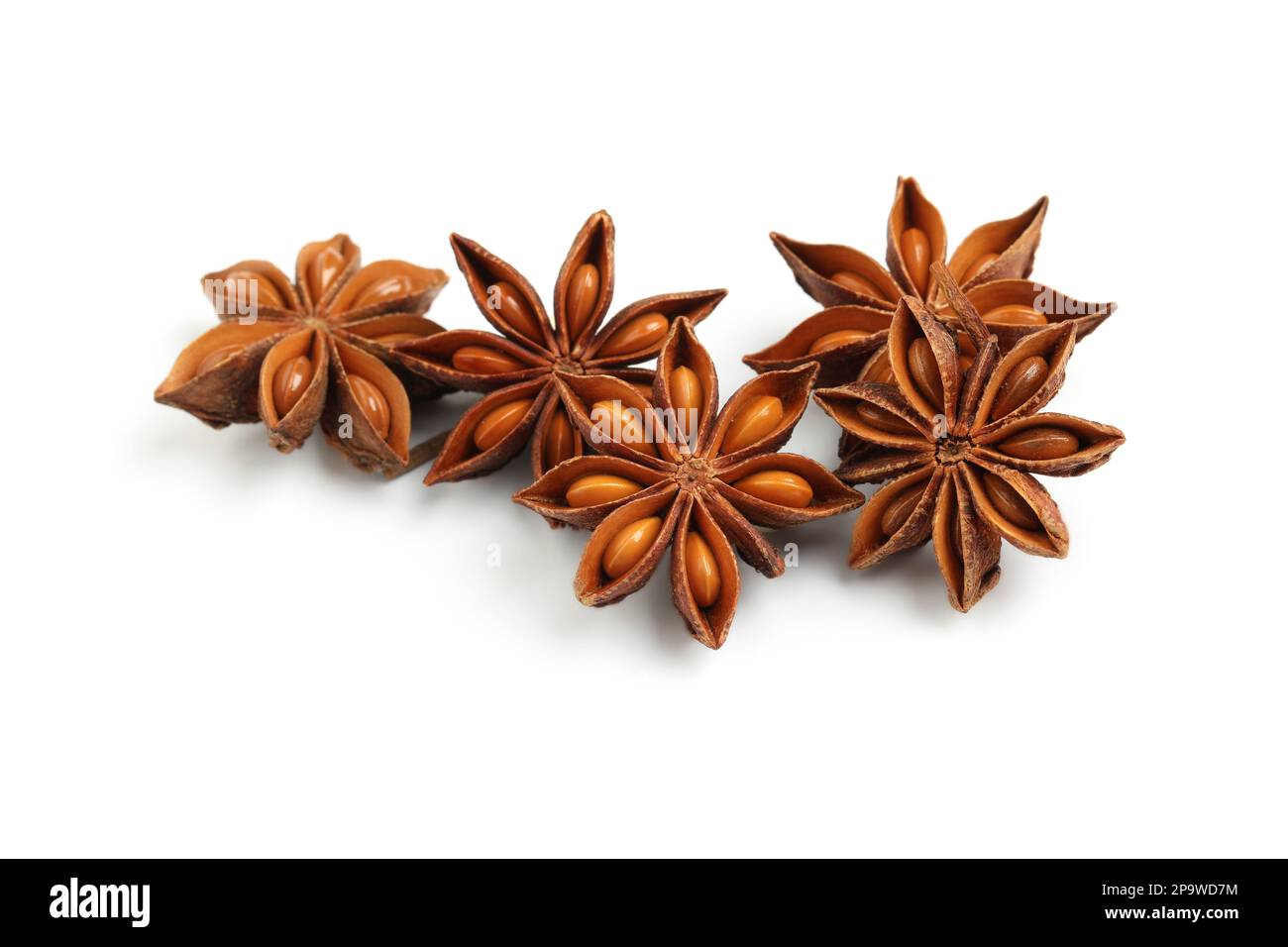 Dry anise stars with seeds on white background Stock Photo - Alamy