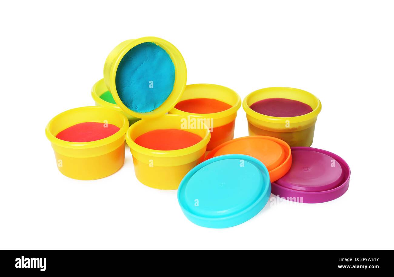 Plastic containers with colorful play dough on white background Stock ...