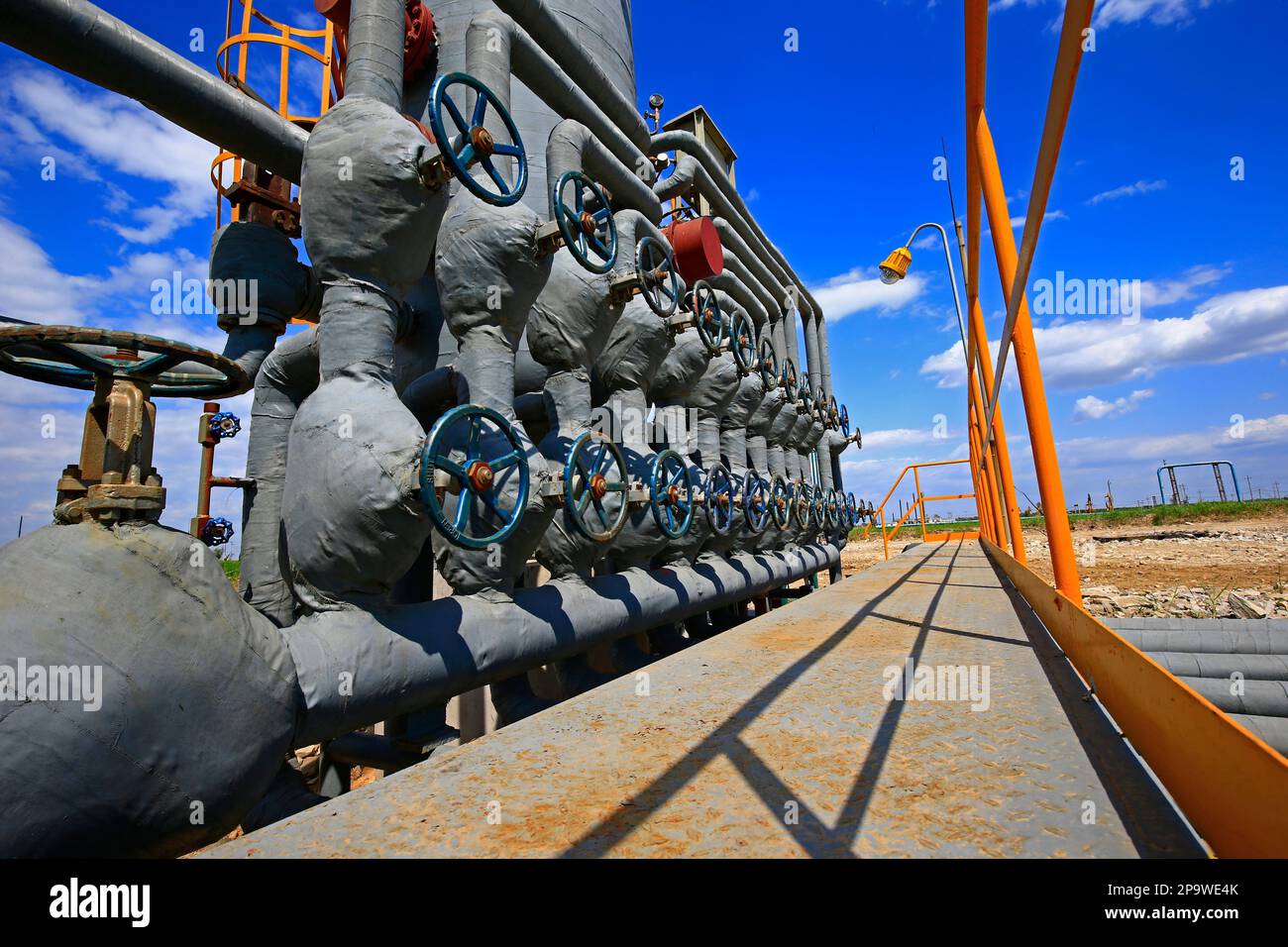 Oil pipes and valves Stock Photo - Alamy