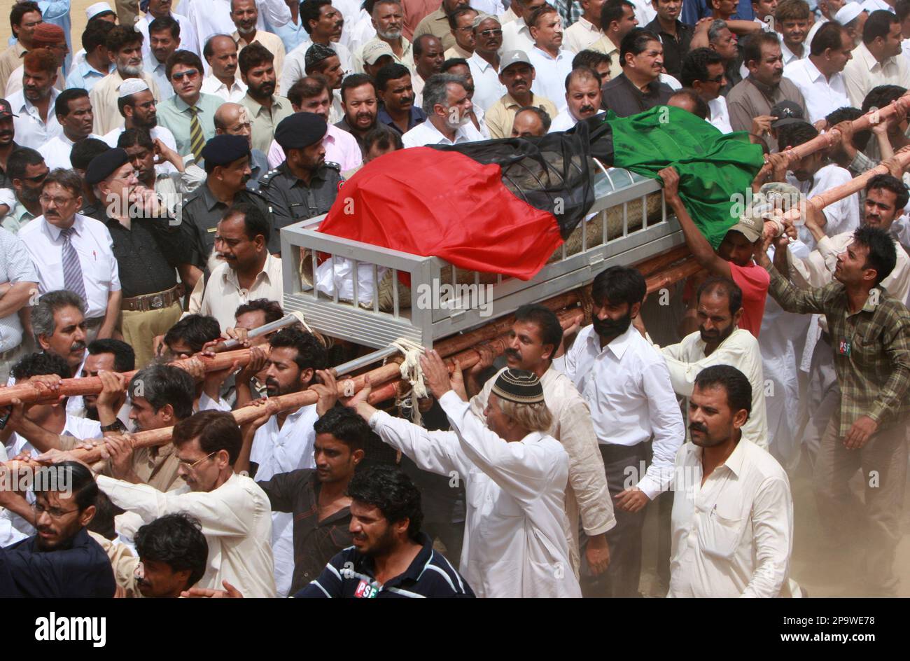 Pakistani mourners carry the coffin with the body of a bodyguard of ...