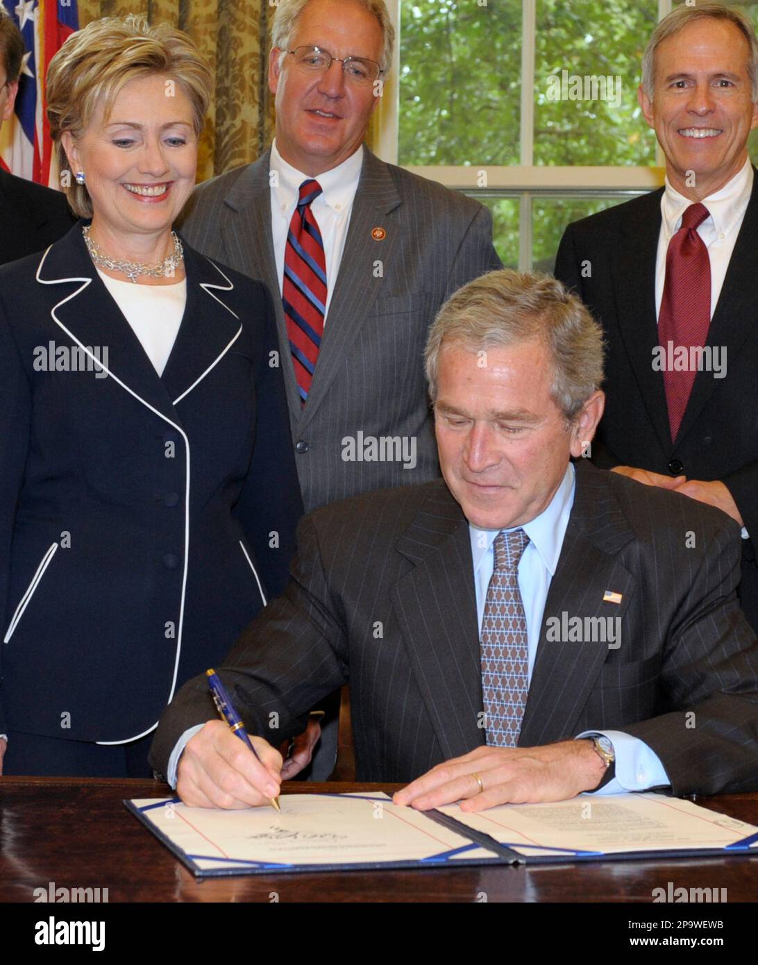 President Bush signs the New and Emerging Technologies 911 Improvement ...