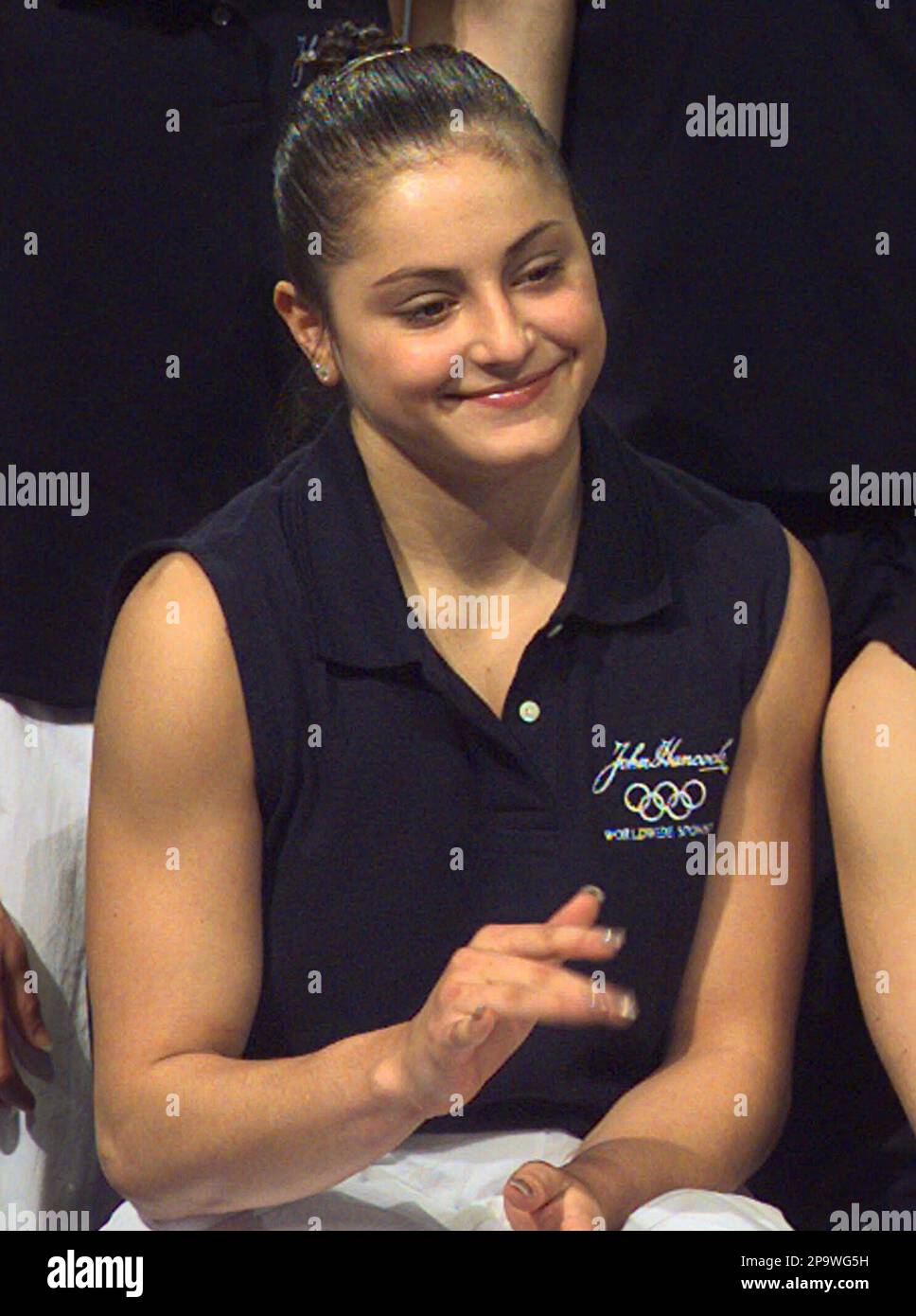 **FILE**In this Aug. 16, 2000 file photo, Dominique Moceanu waves while ...