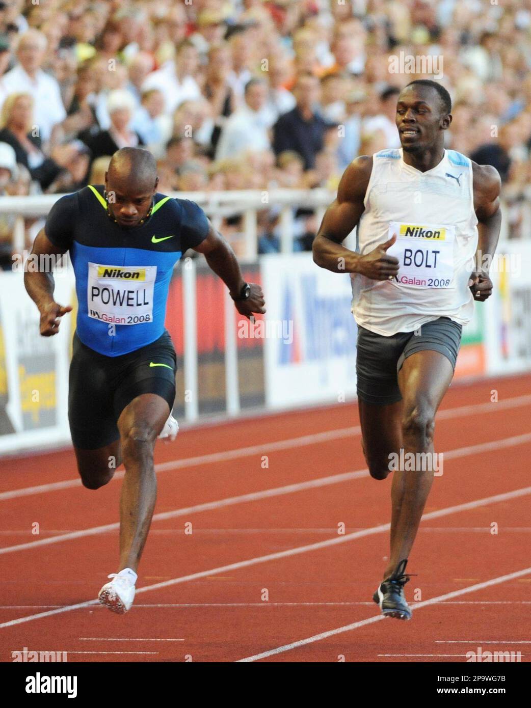 Jamaica's Asafa Powell, left, wins the men's 100 metres ahead of Usain ...
