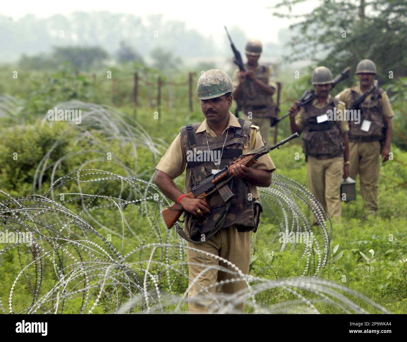 Indian paramilitary soldiers patrol outside the base camp of pilgrims ...