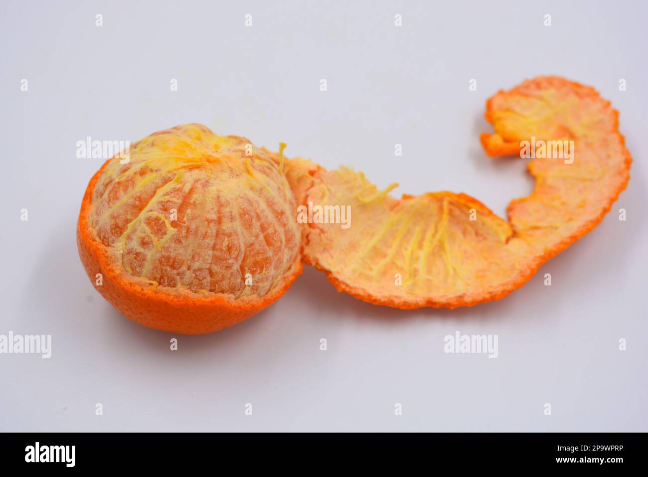 Fresh fruits, orange tangerine with a thin skin removed is located on a ...