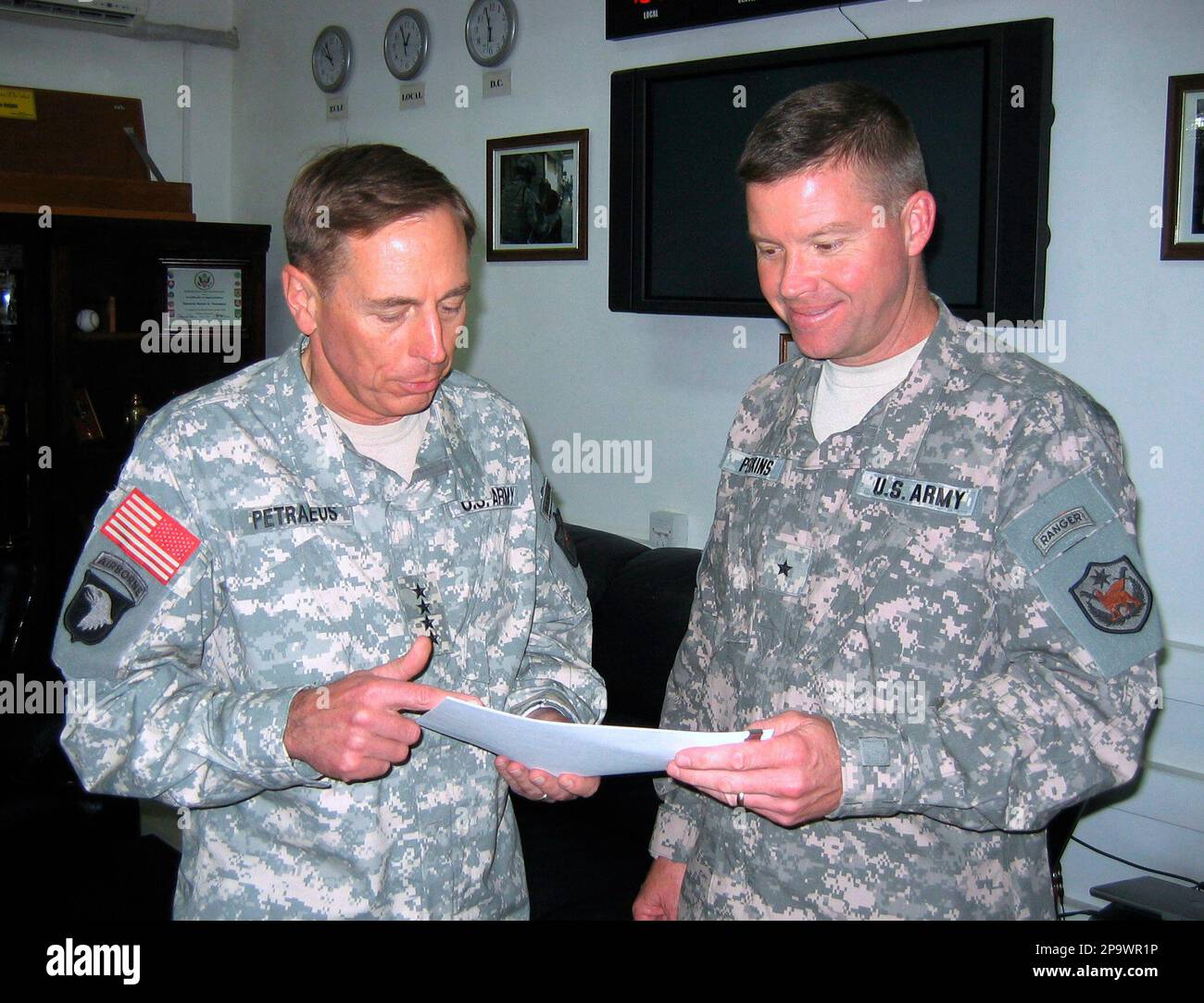 Gen. David Petraeus, left, the top U.S. commander in Iraq, talks with ...