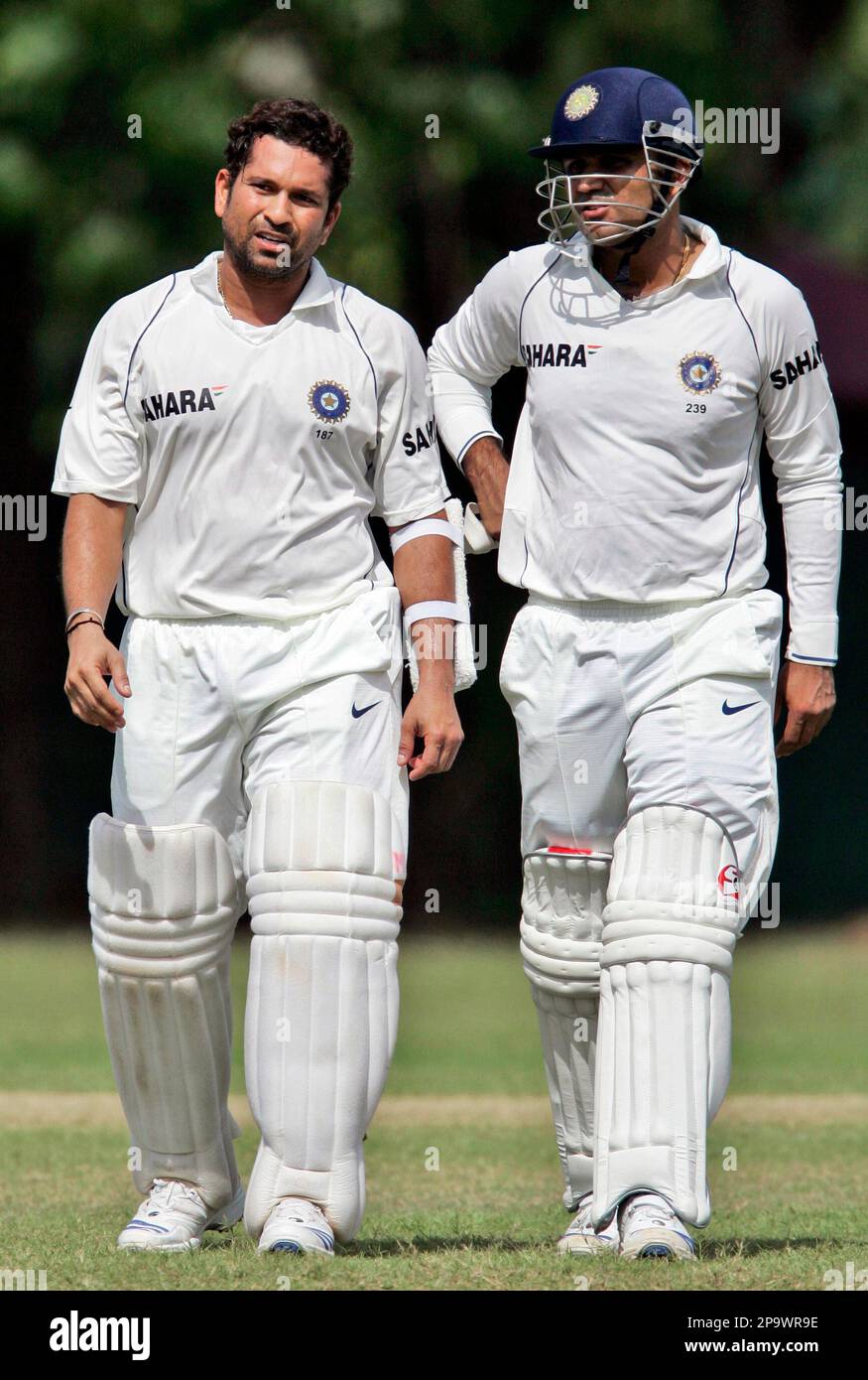 Indian cricketers Virender Sehwag, right, and Sachin Tendulkar take a ...