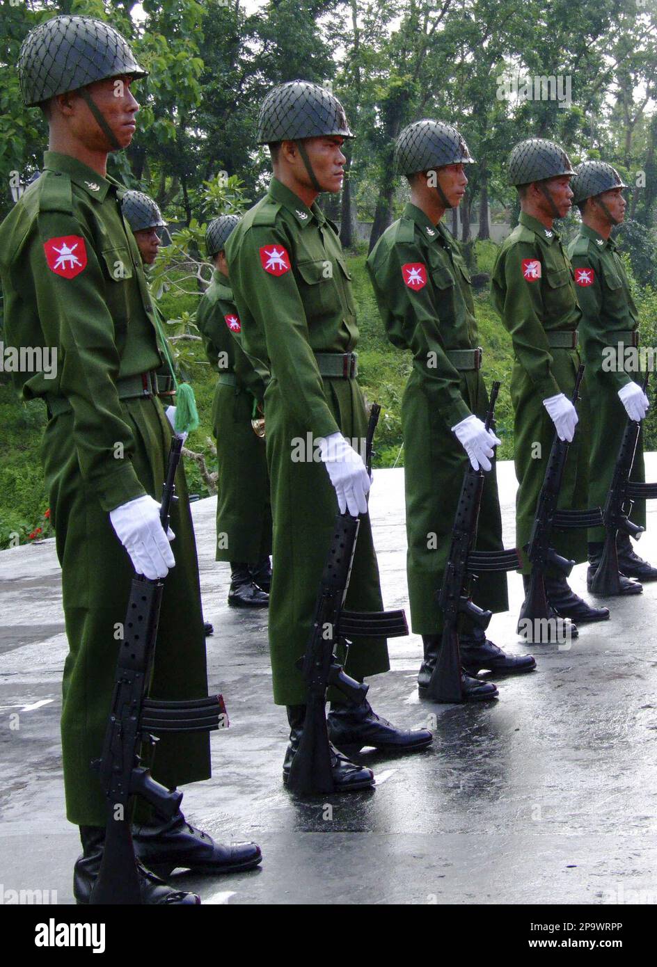 Soldiers from the Myanmar honor guard stand at attention at the Martyr ...