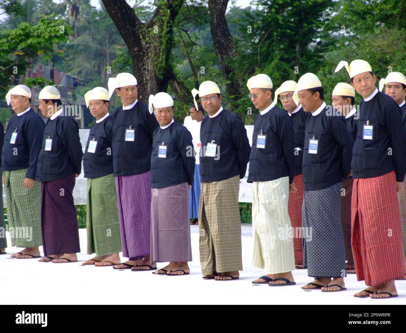 Myanmar government officers, wearing traditional ceremonial civilian ...