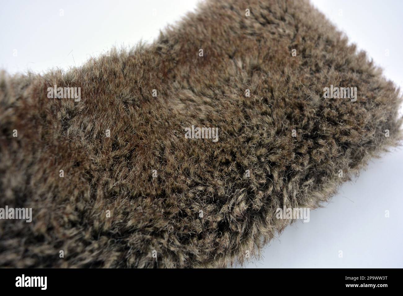 Fluffy synthetic fabric in the form of natural cinnamon yellow fur with ...