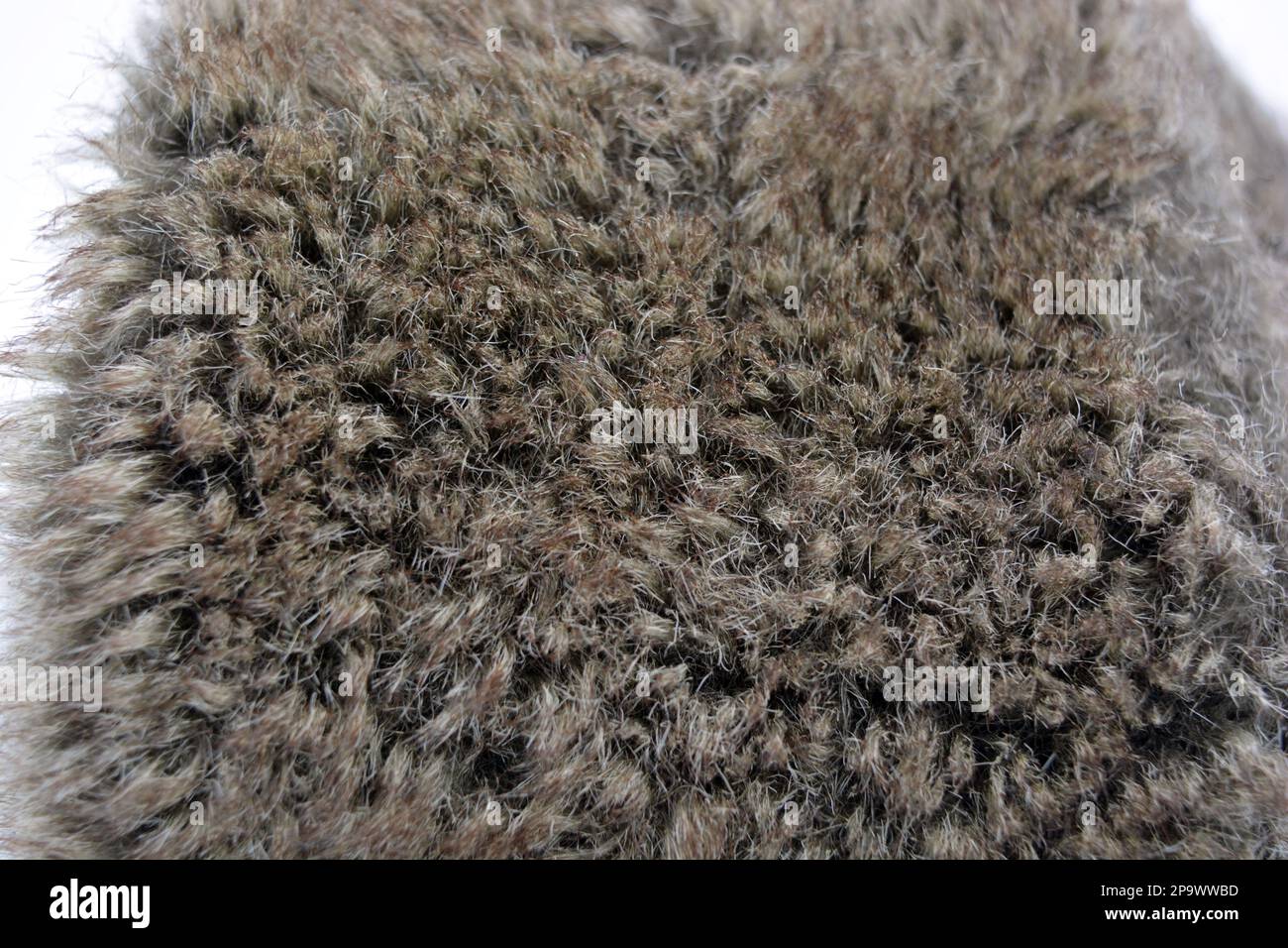 Fluffy synthetic fabric in the form of natural cinnamon yellow fur with ...