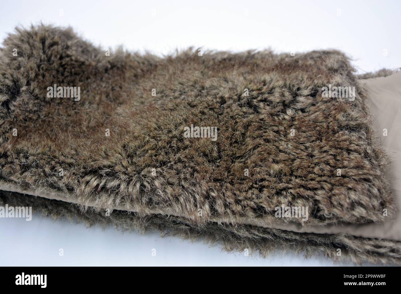 Fluffy synthetic fabric in the form of natural cinnamon yellow fur with ...